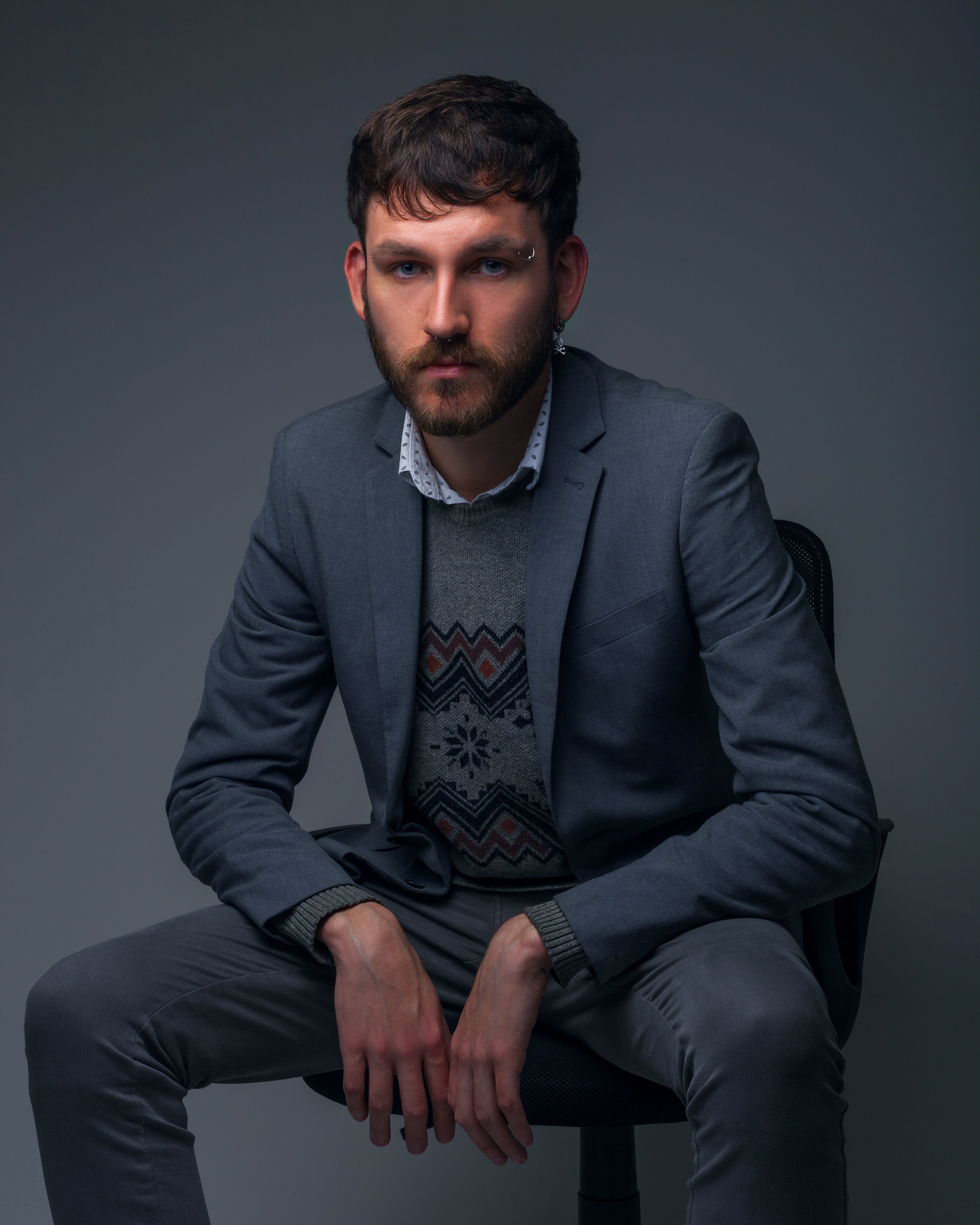 Man Sitting on Chair Looking at His Watch · Free Stock Photo