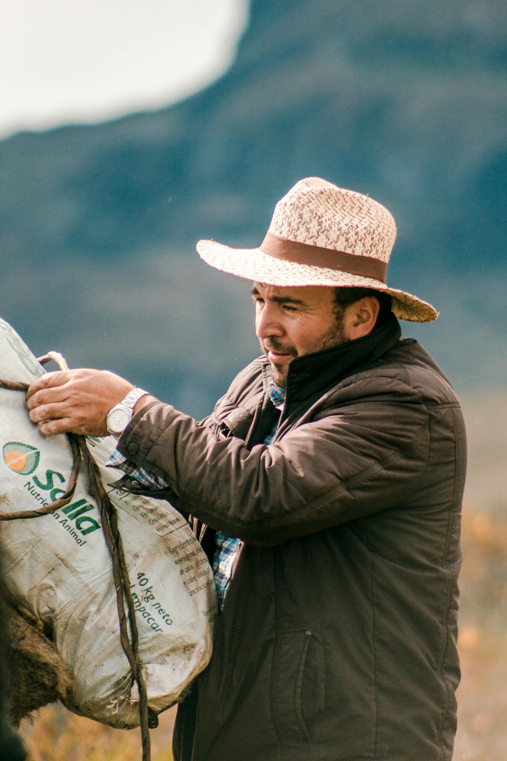 Man Wearing Straw Hat on a Farm · Free Stock Photo