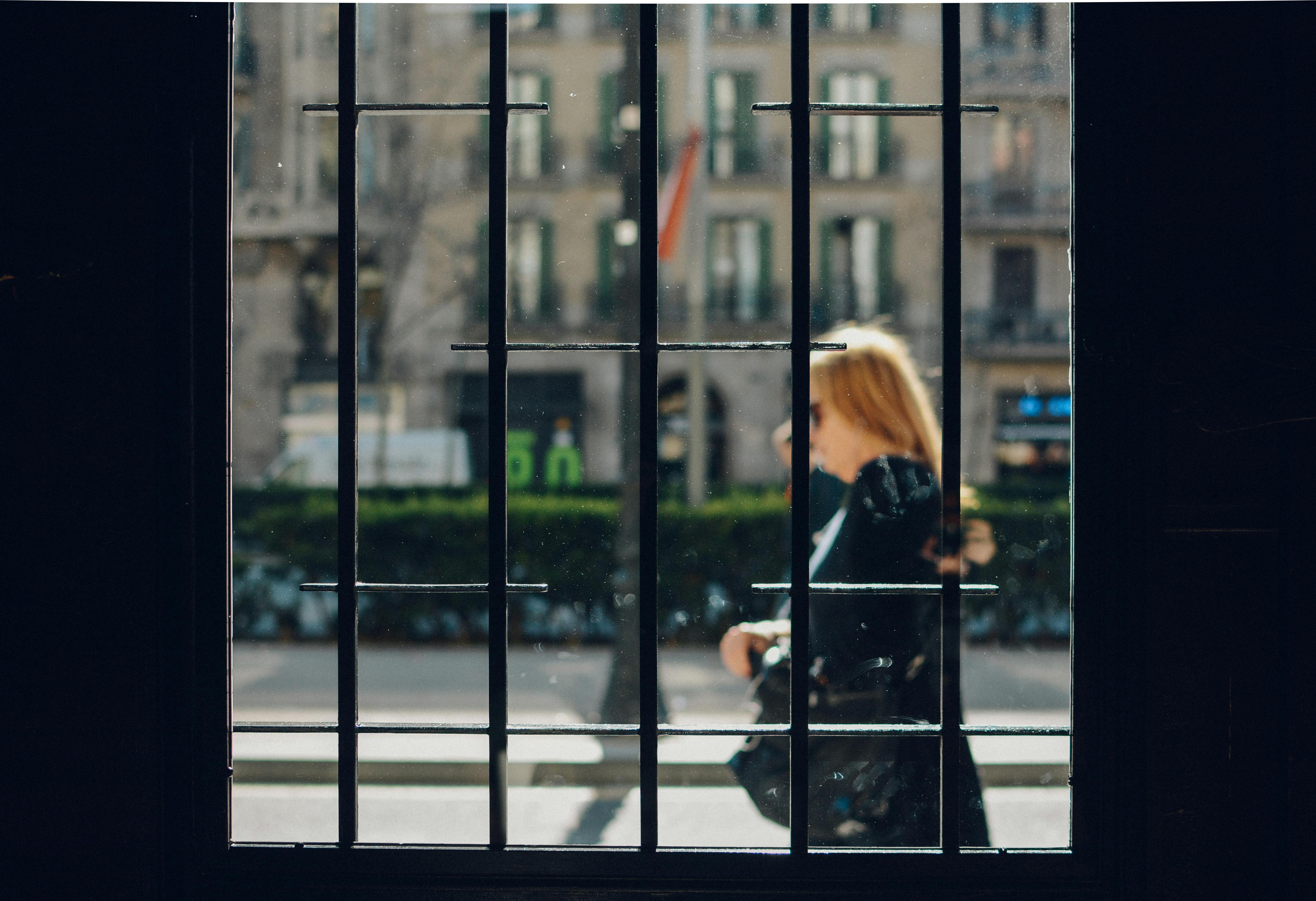 Woman Walking in Front of Building · Free Stock Photo