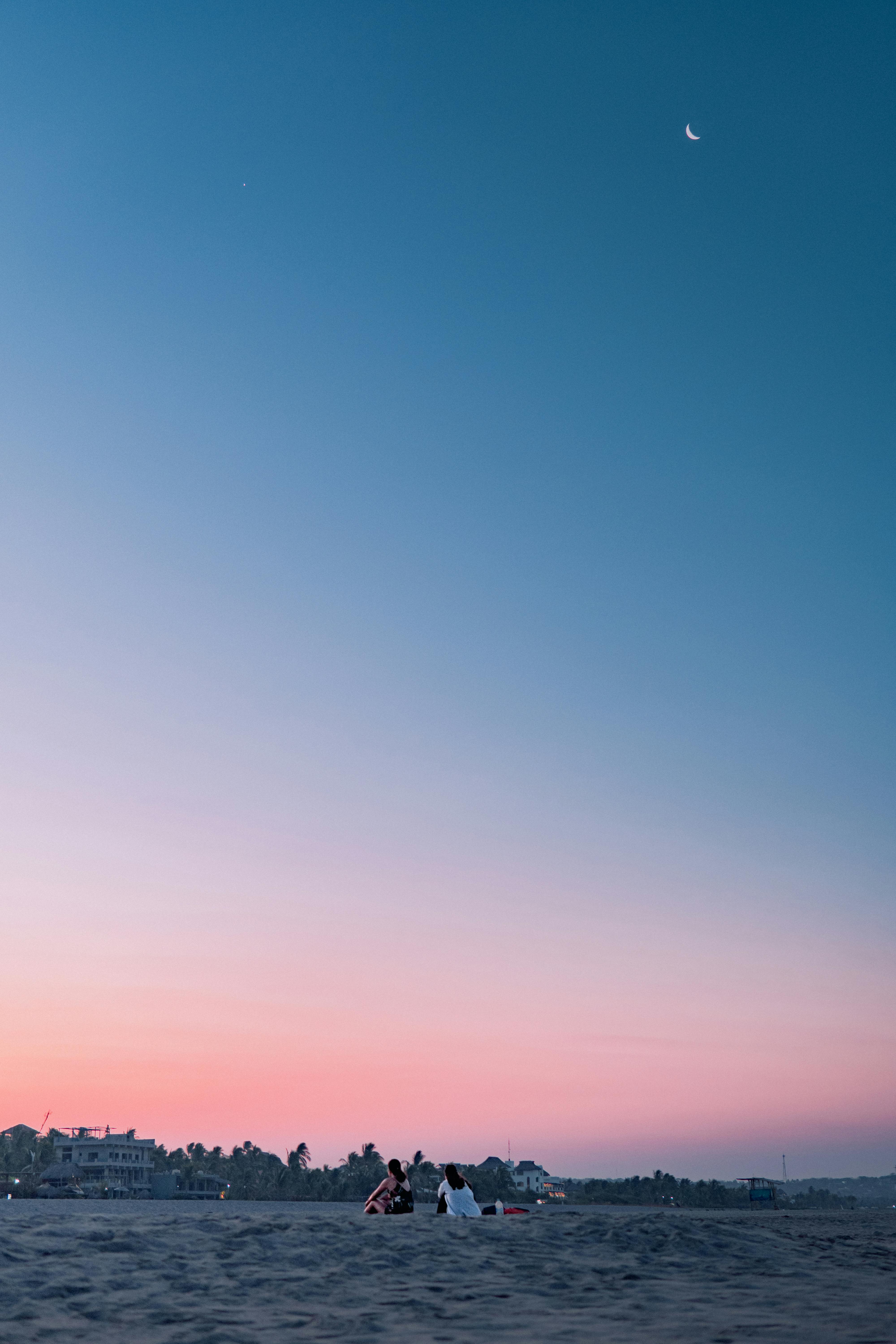 Two People on Beach Sand during Sunset · Free Stock Photo