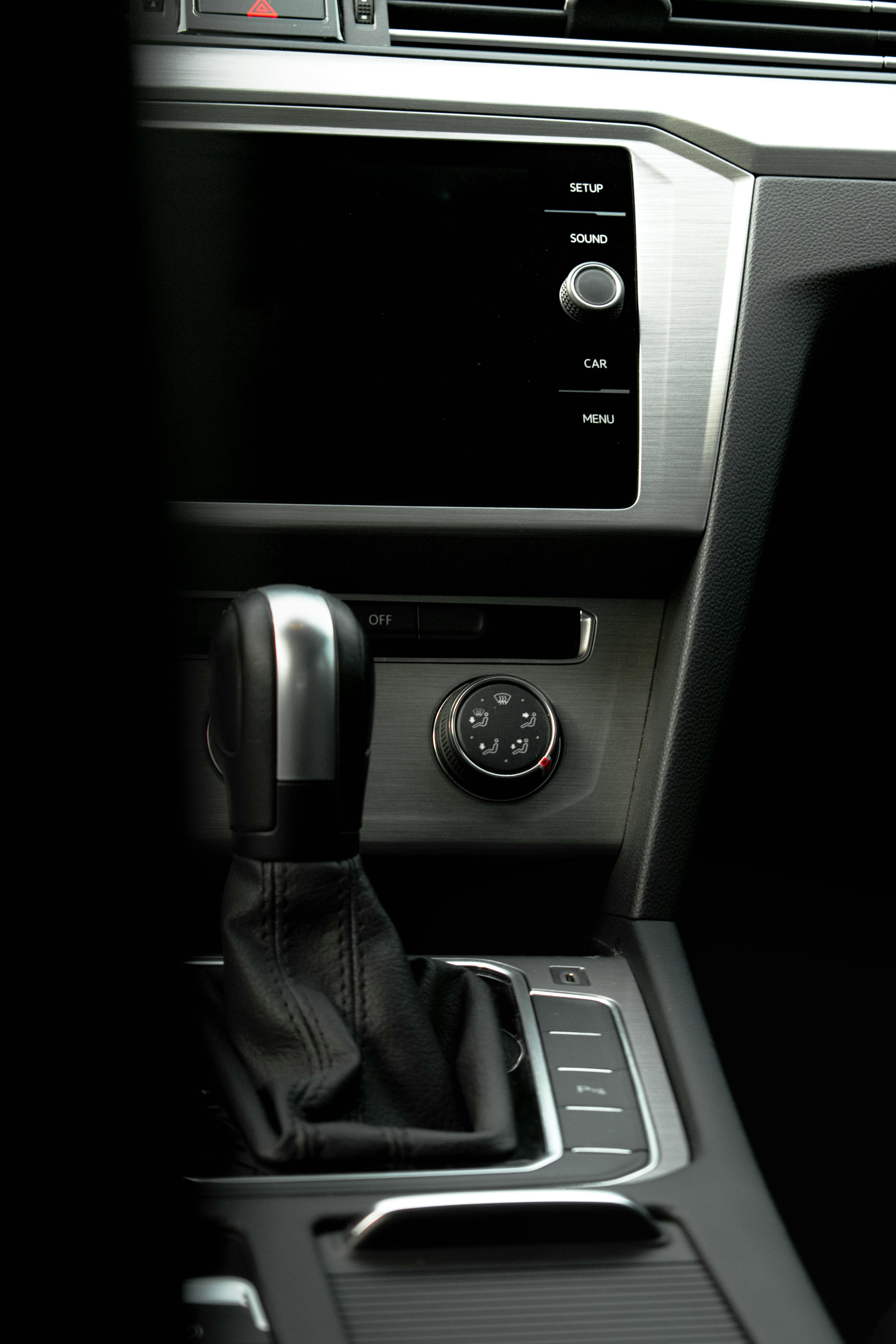 A Black and Gray Car Gear Shift Lever and Headunit · Free Stock Photo