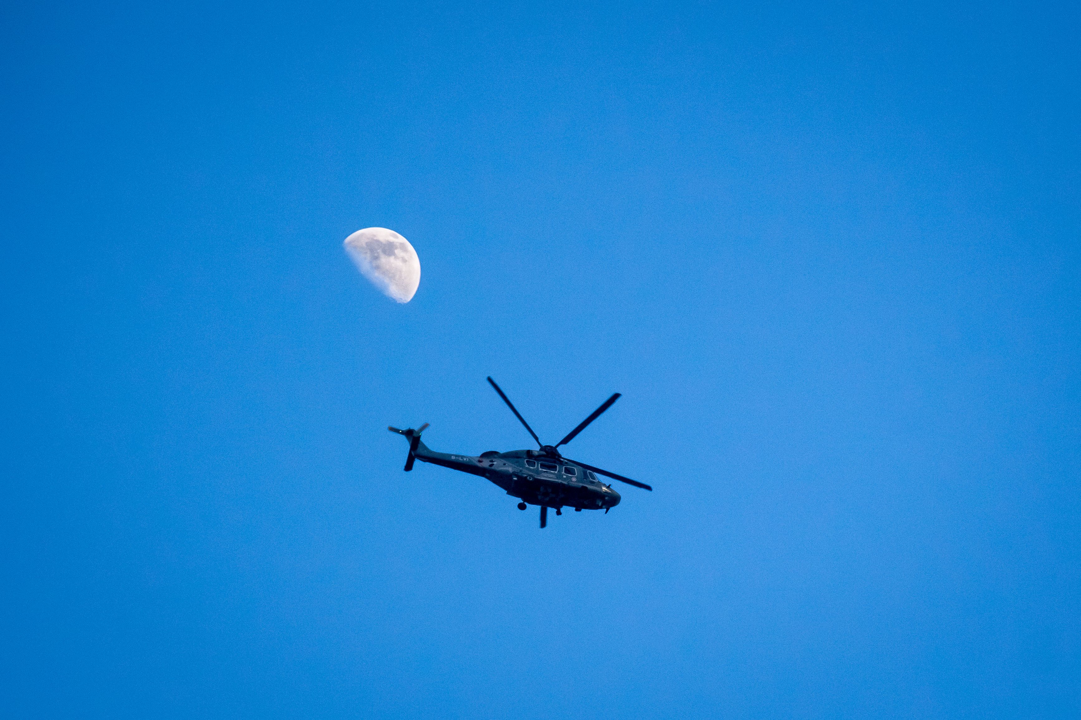 A Helicopter and a Moon in the Sky · Free Stock Photo