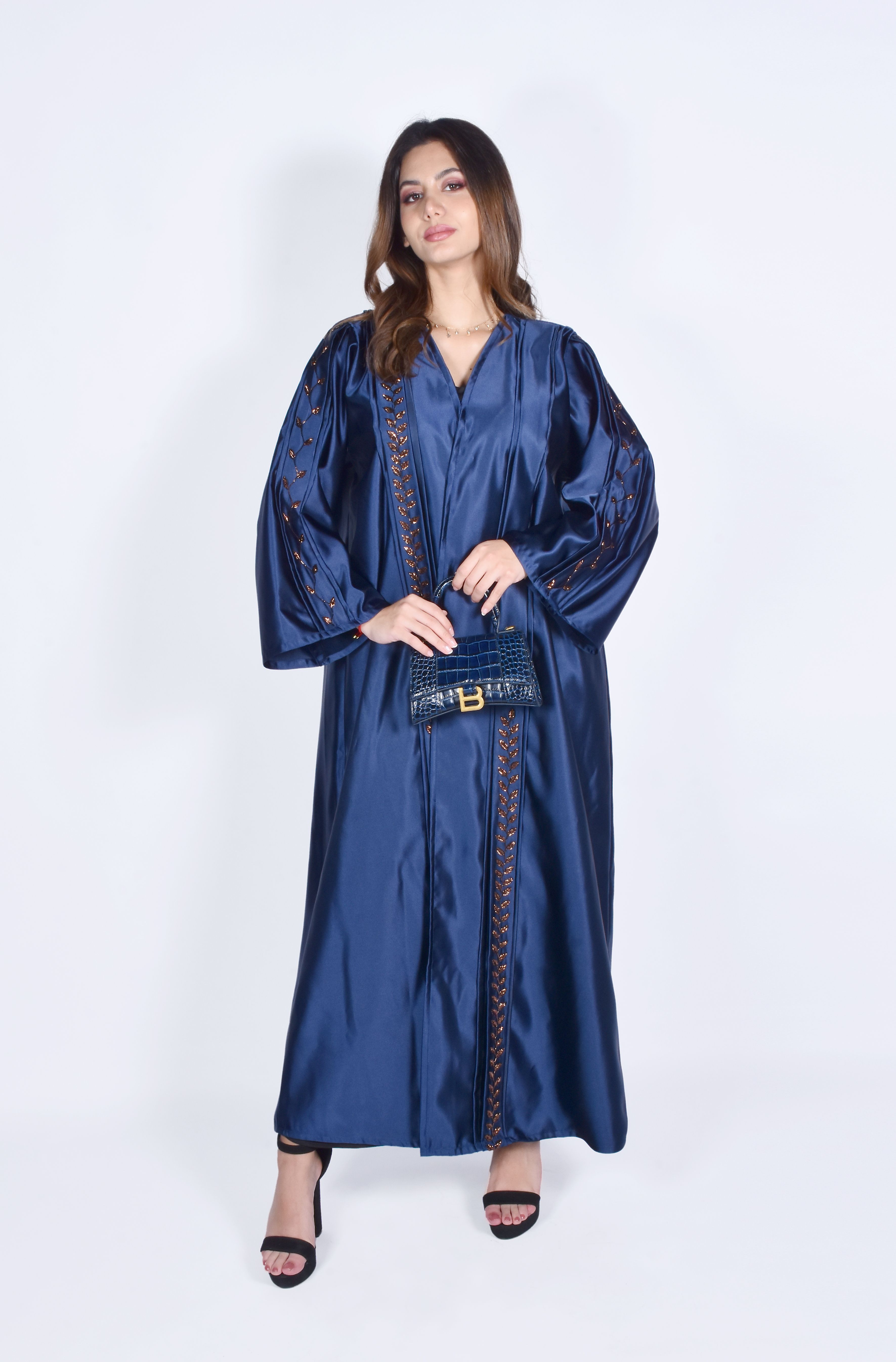 A Woman Wearing a Blue Silk Dress Standing in a White Background · Free ...