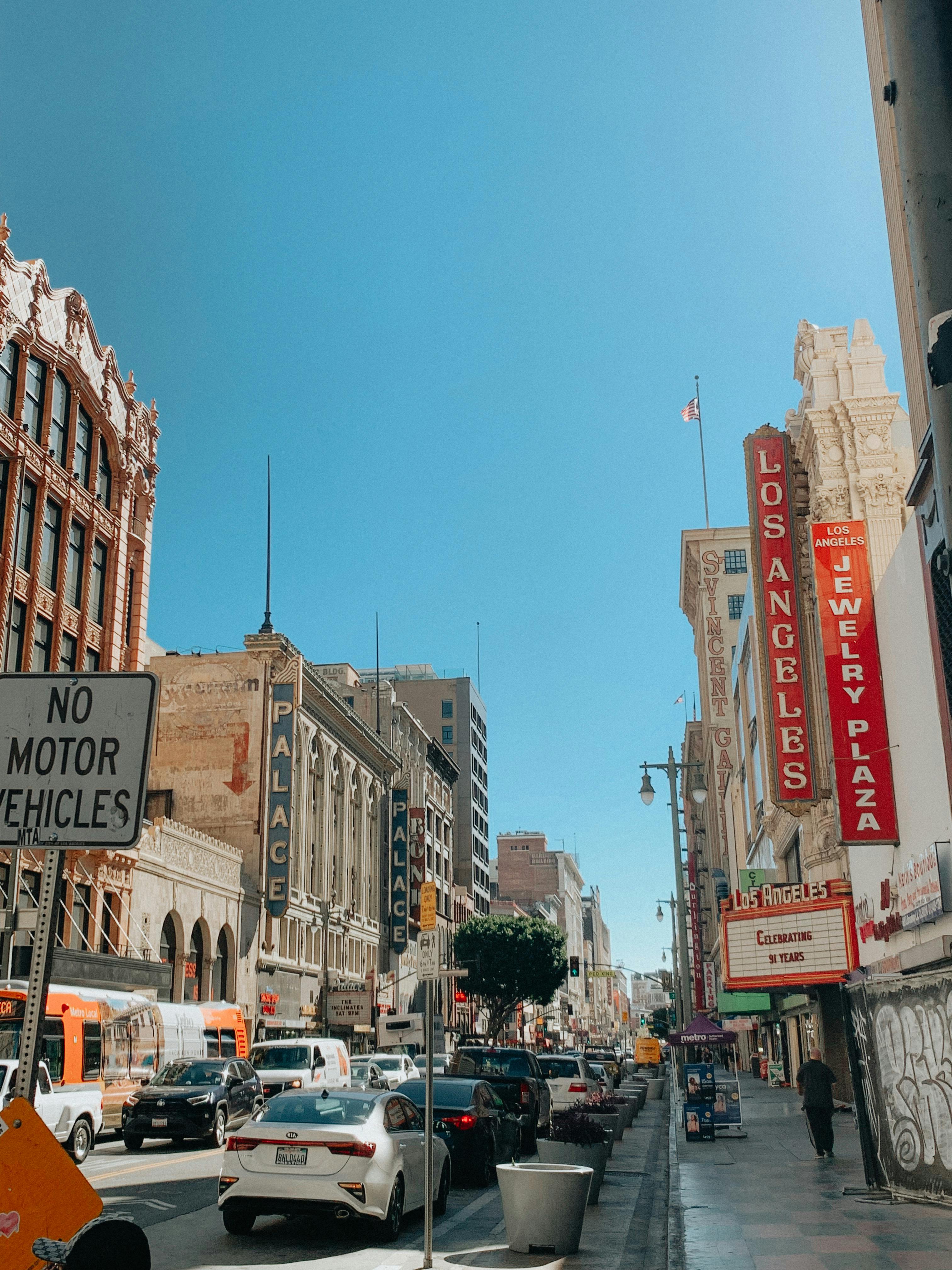 Cars Parked on Roadside near the Buildings · Free Stock Photo