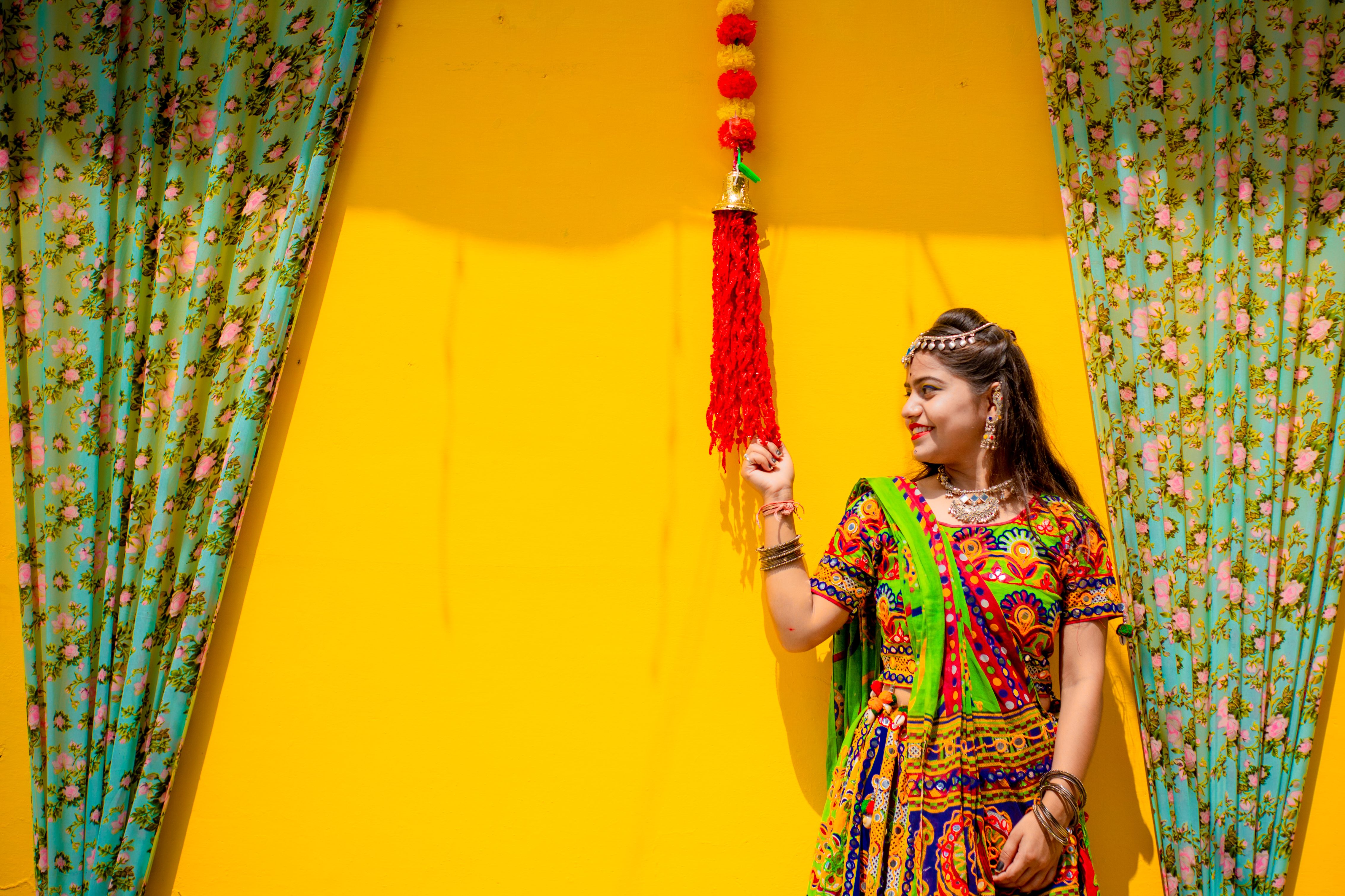 Model in Traditional Clothing with Snake and Trident · Free Stock Photo