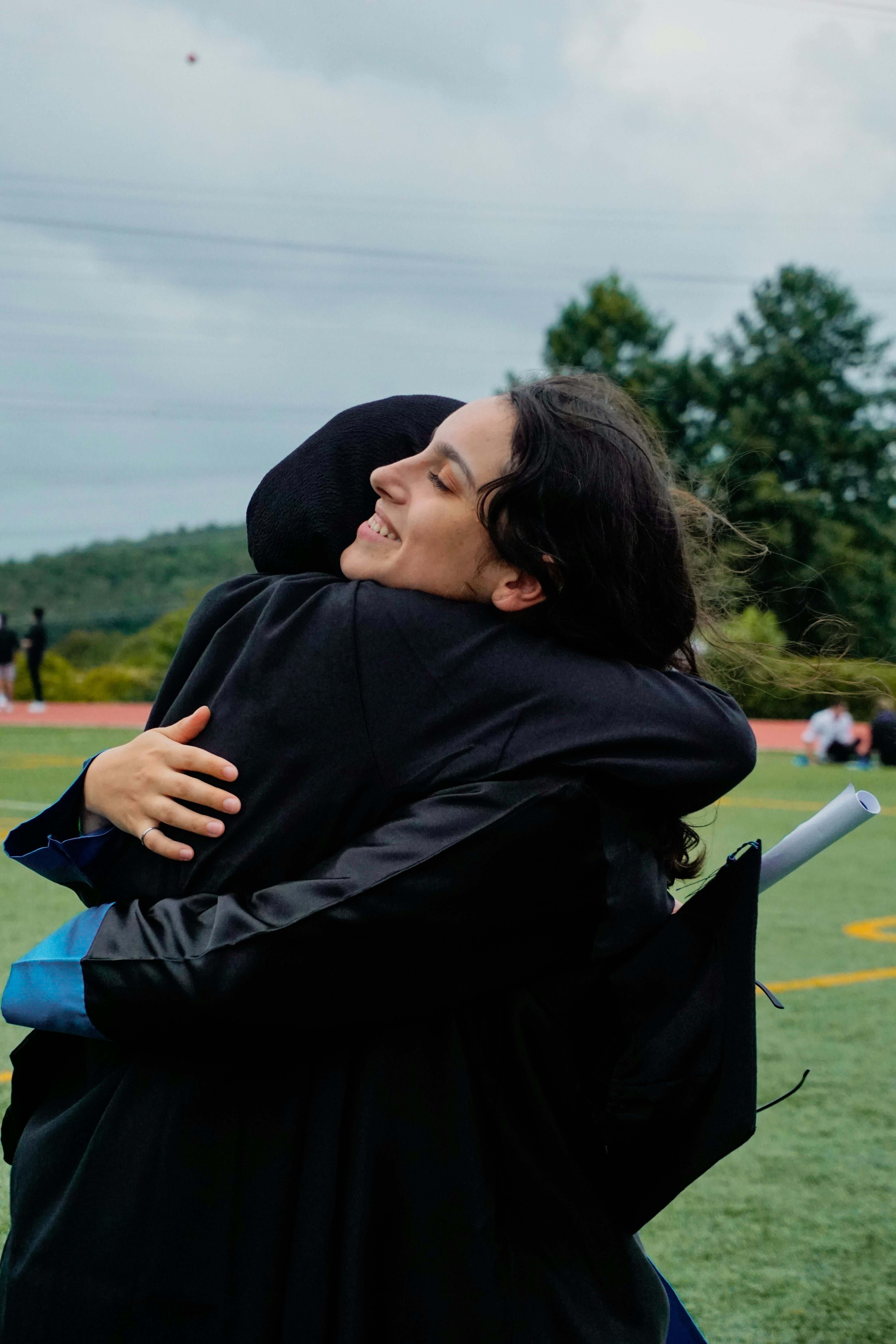 Two People Smiling and Embracing · Free Stock Photo