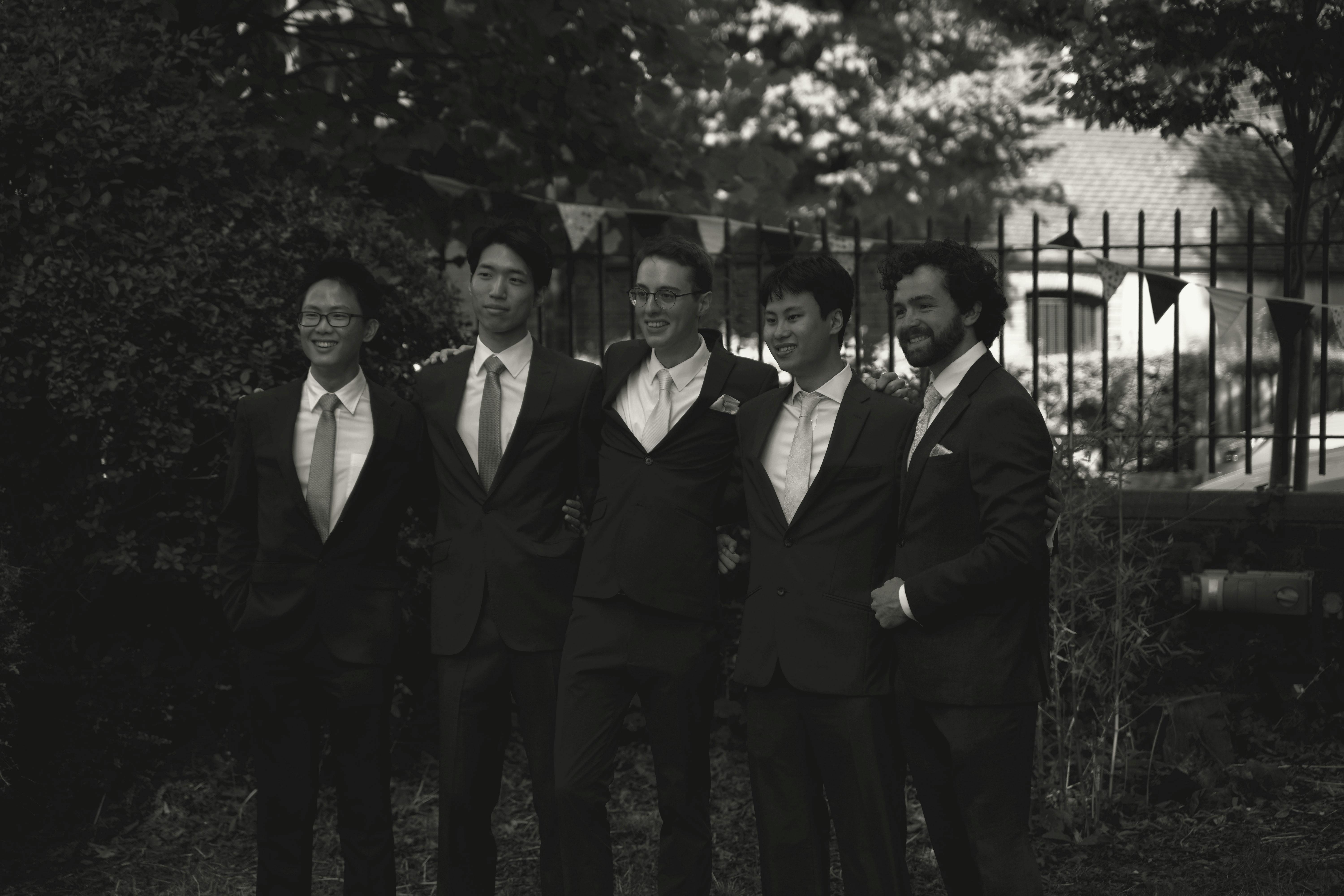 Grayscale Photo of Five Men Wearing Black Suits · Free Stock Photo