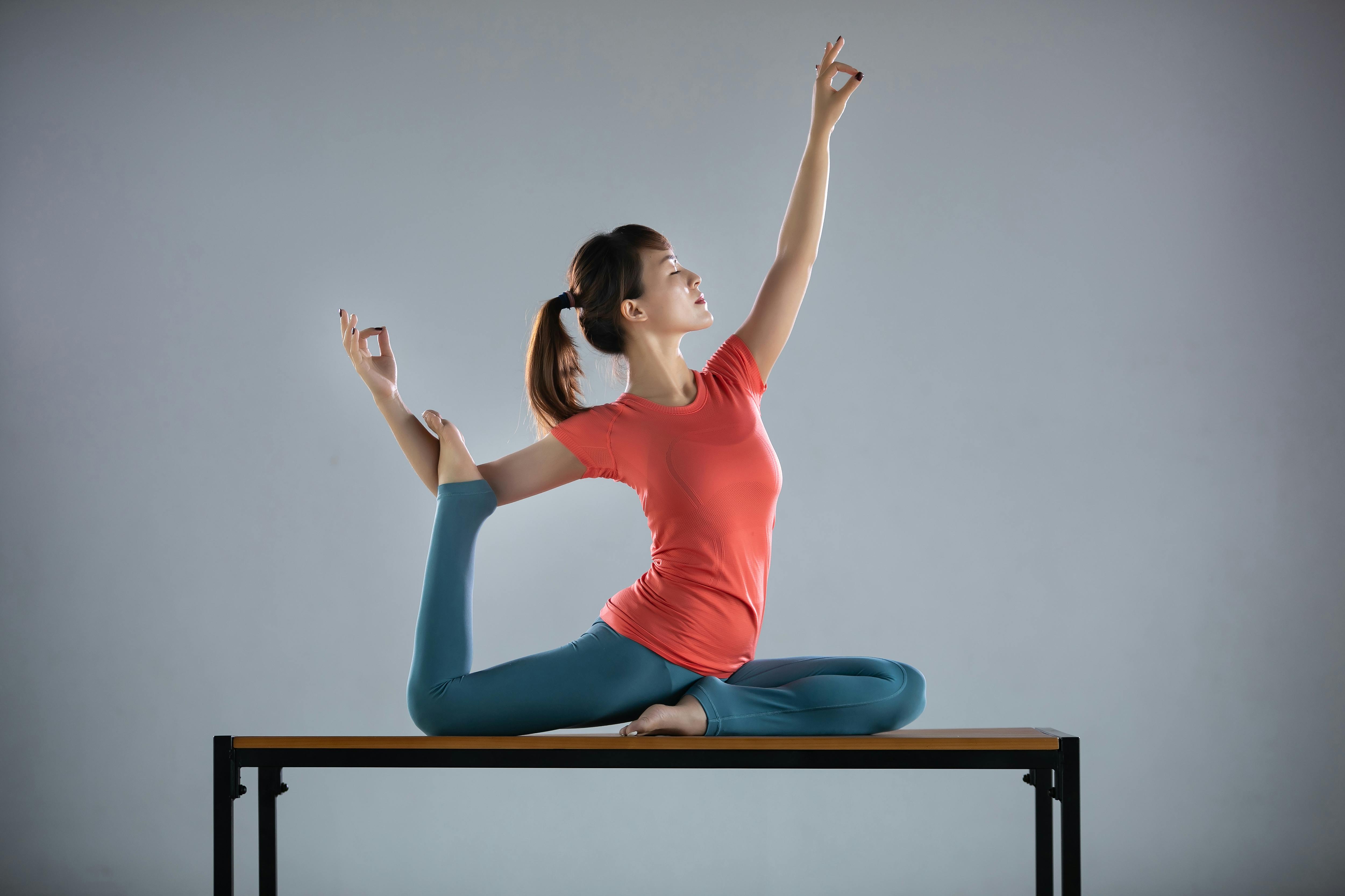 Woman Exercising on a Table · Free Stock Photo
