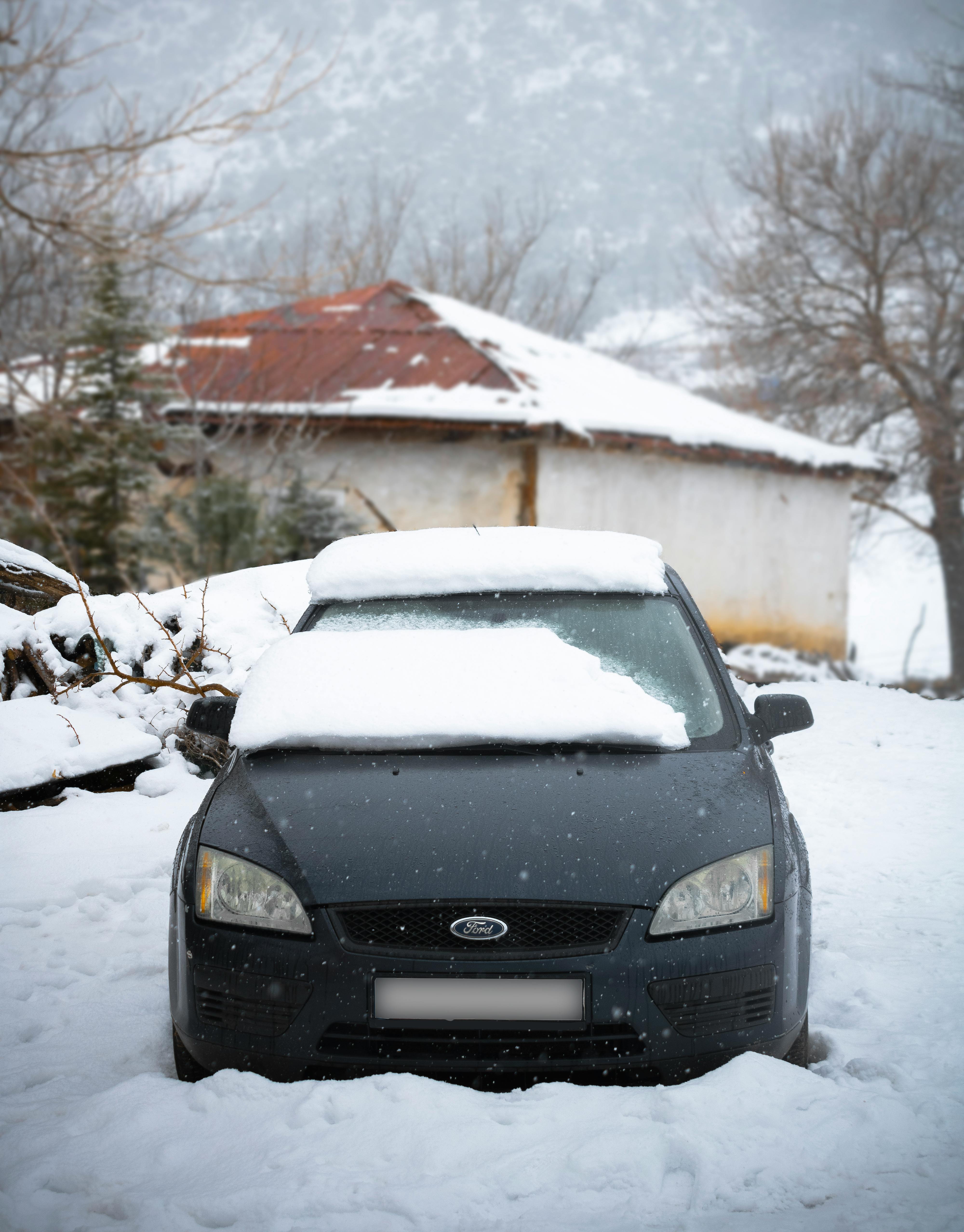 A Sports Car Covered in Snow · Free Stock Photo