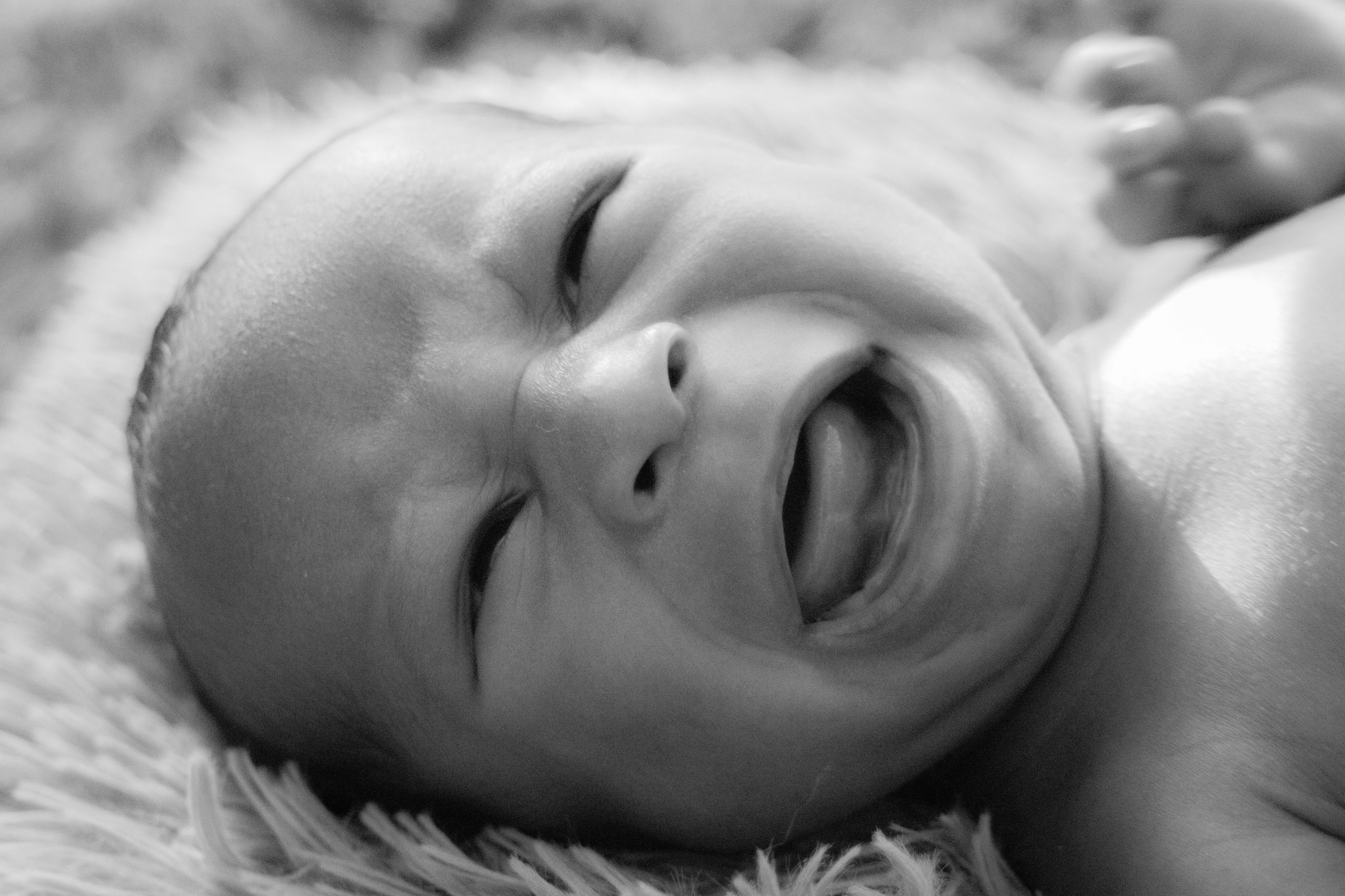 Grayscale Photo of a Baby · Free Stock Photo