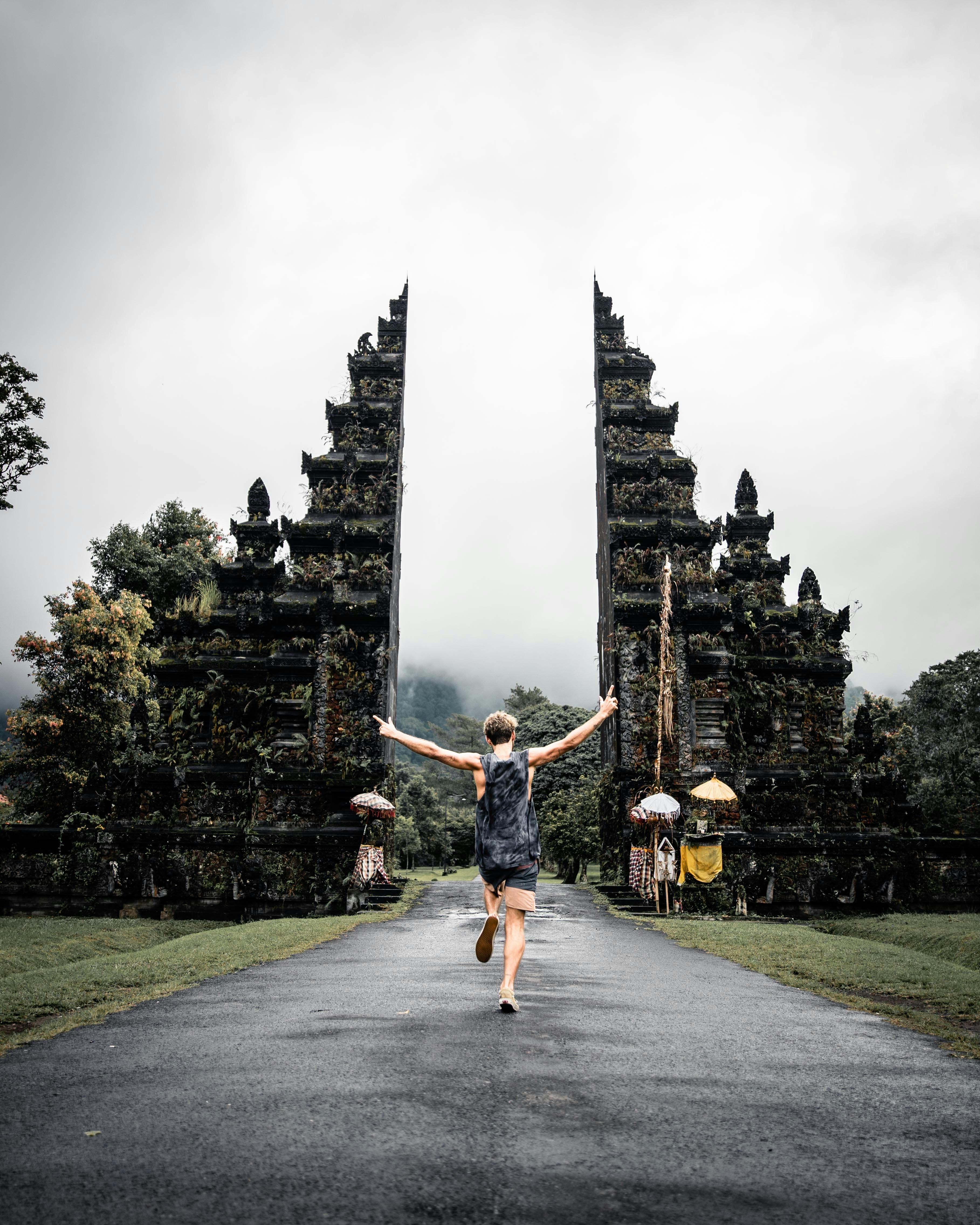 Back View of a Woman Walking Towards the Famous Bali Handara Gate ...