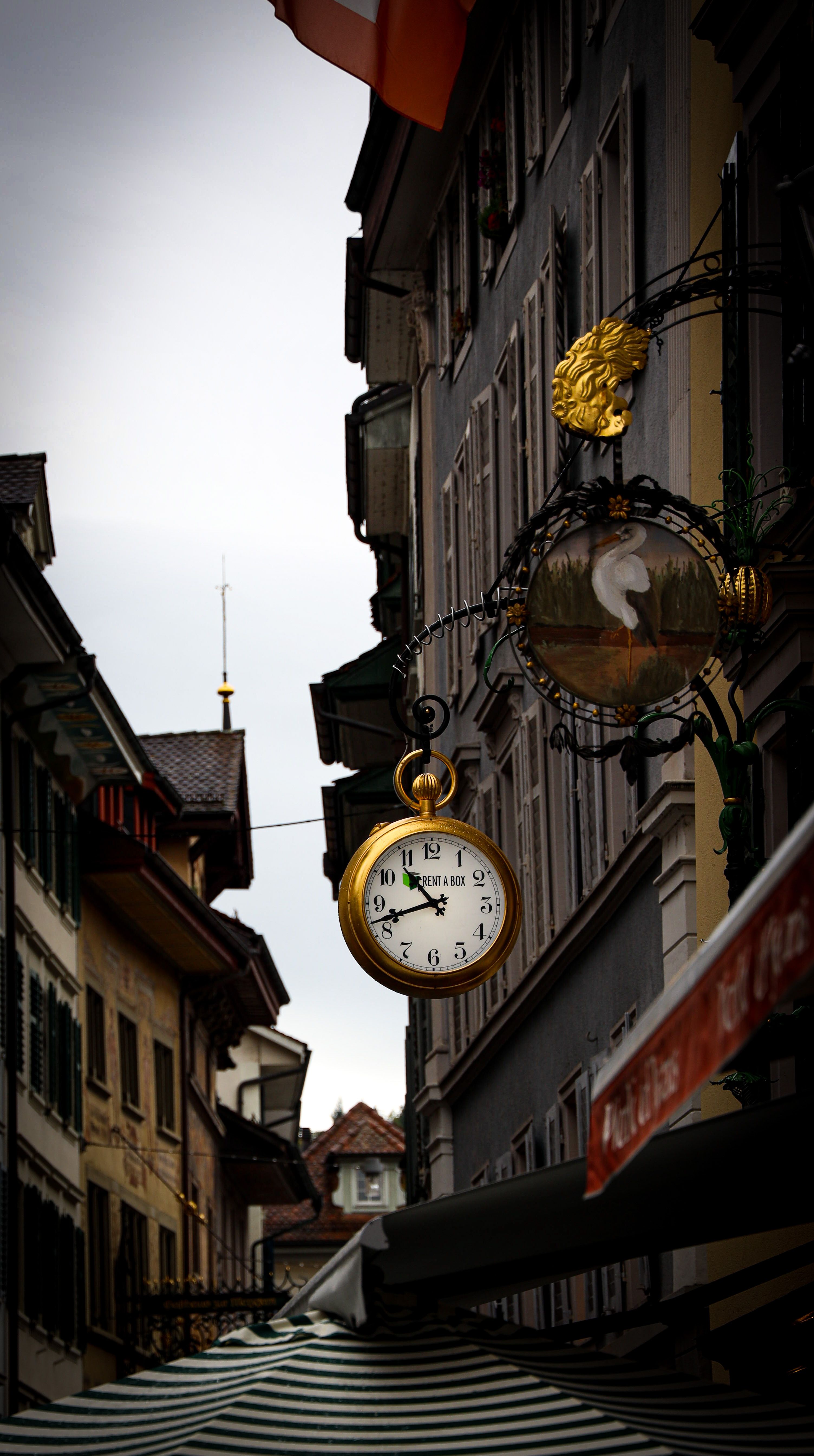 Classic Clock Hanging on Building Wall · Free Stock Photo