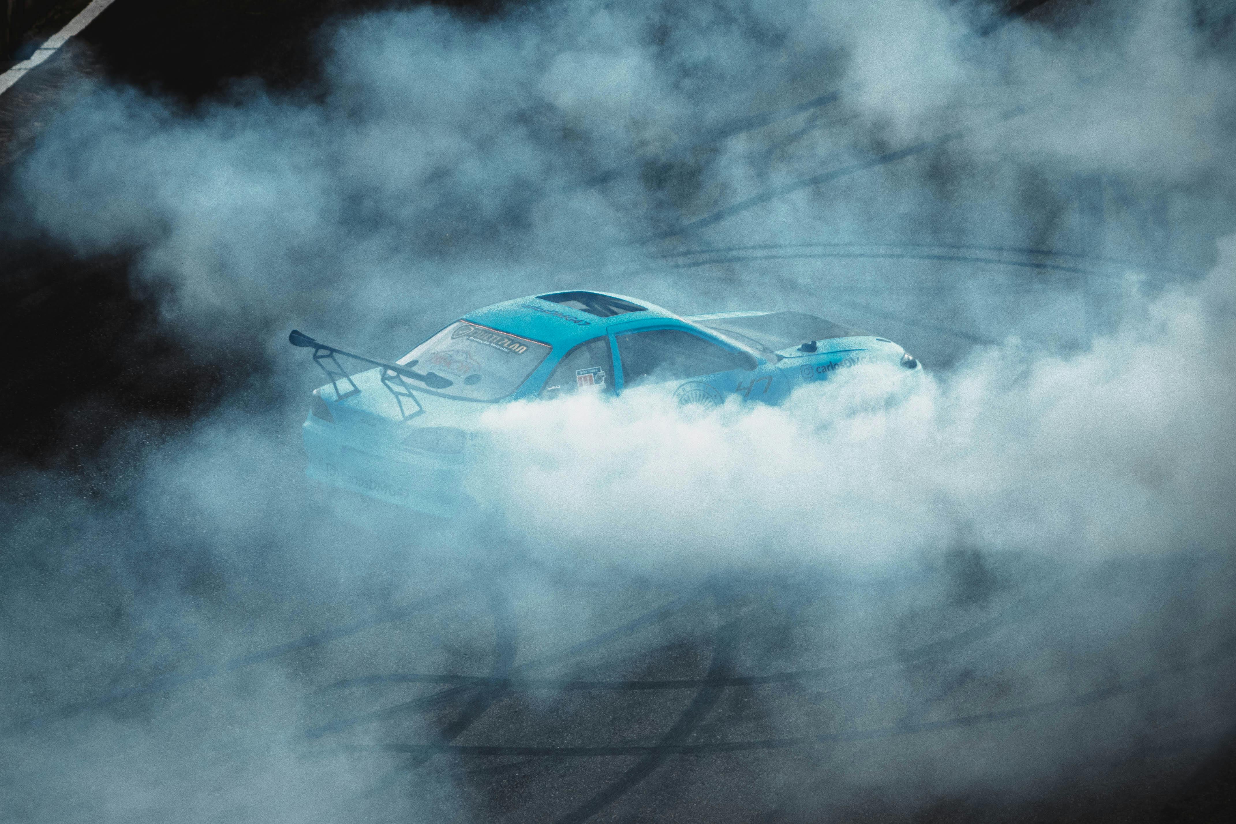 A Yellow Sports Car Drifting · Free Stock Photo