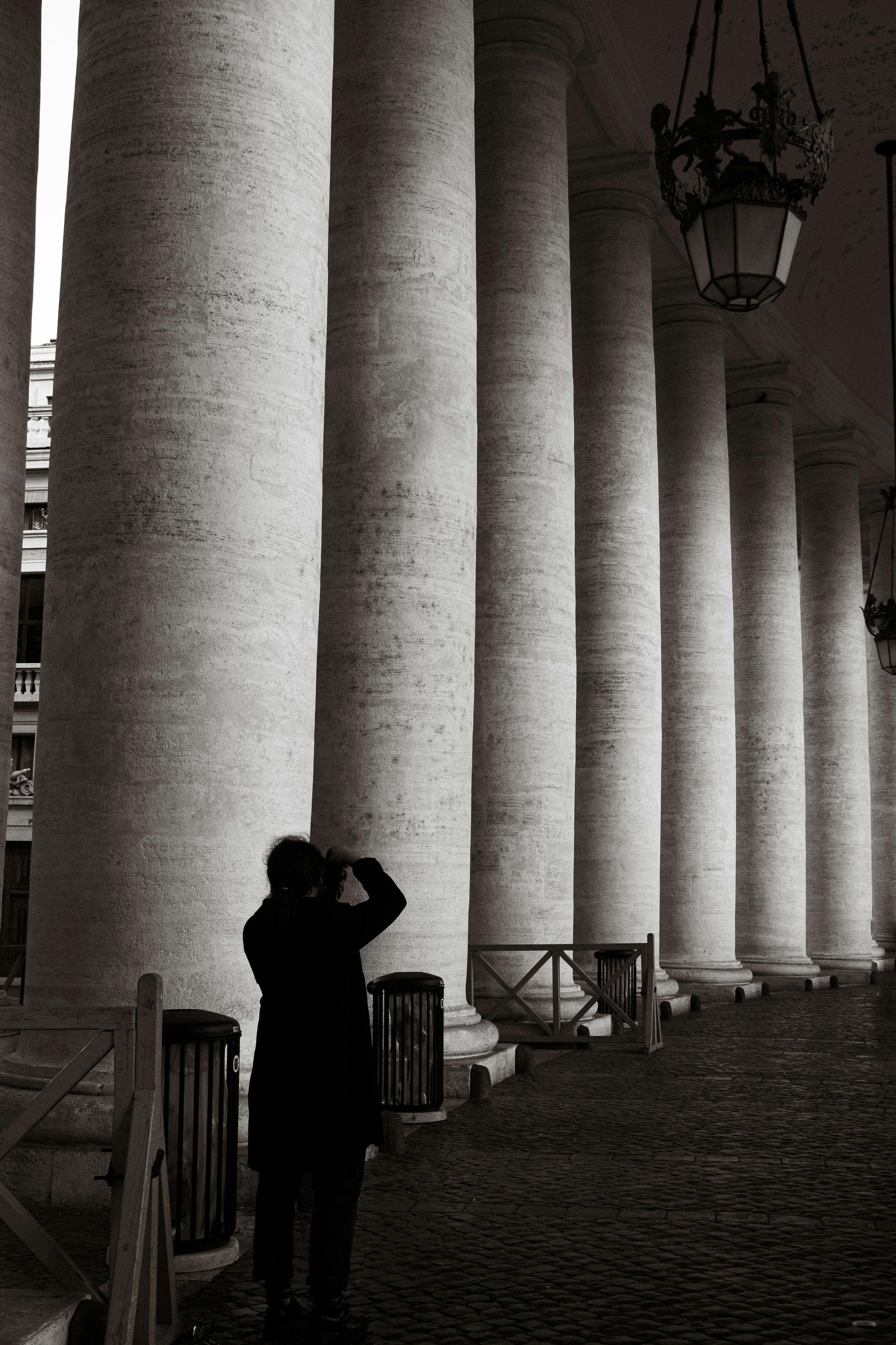 Person Photographing Large Columns · Free Stock Photo