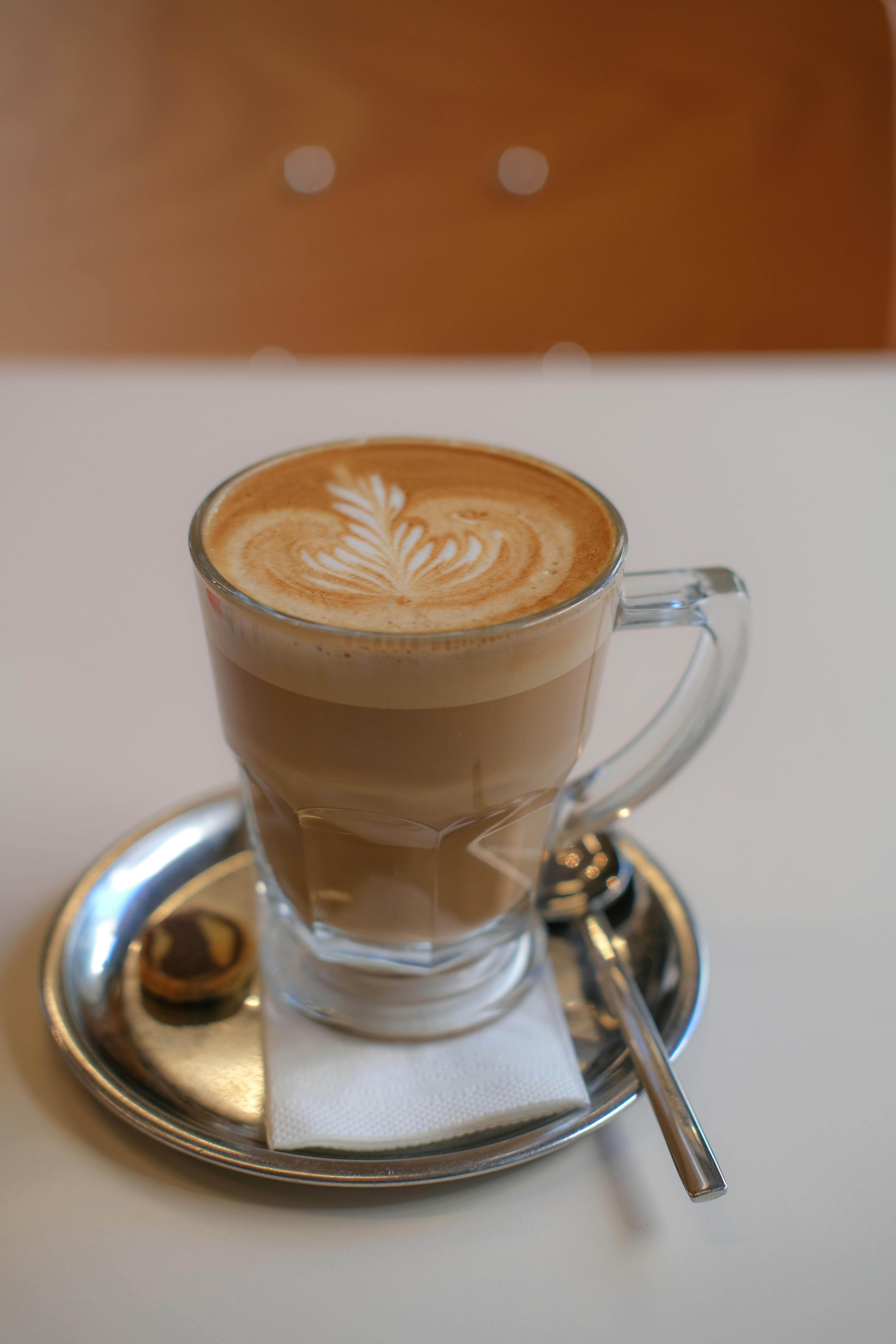 Clear Glass Cup with Cafe Latte on Stainless Steel Saucer · Free Stock ...