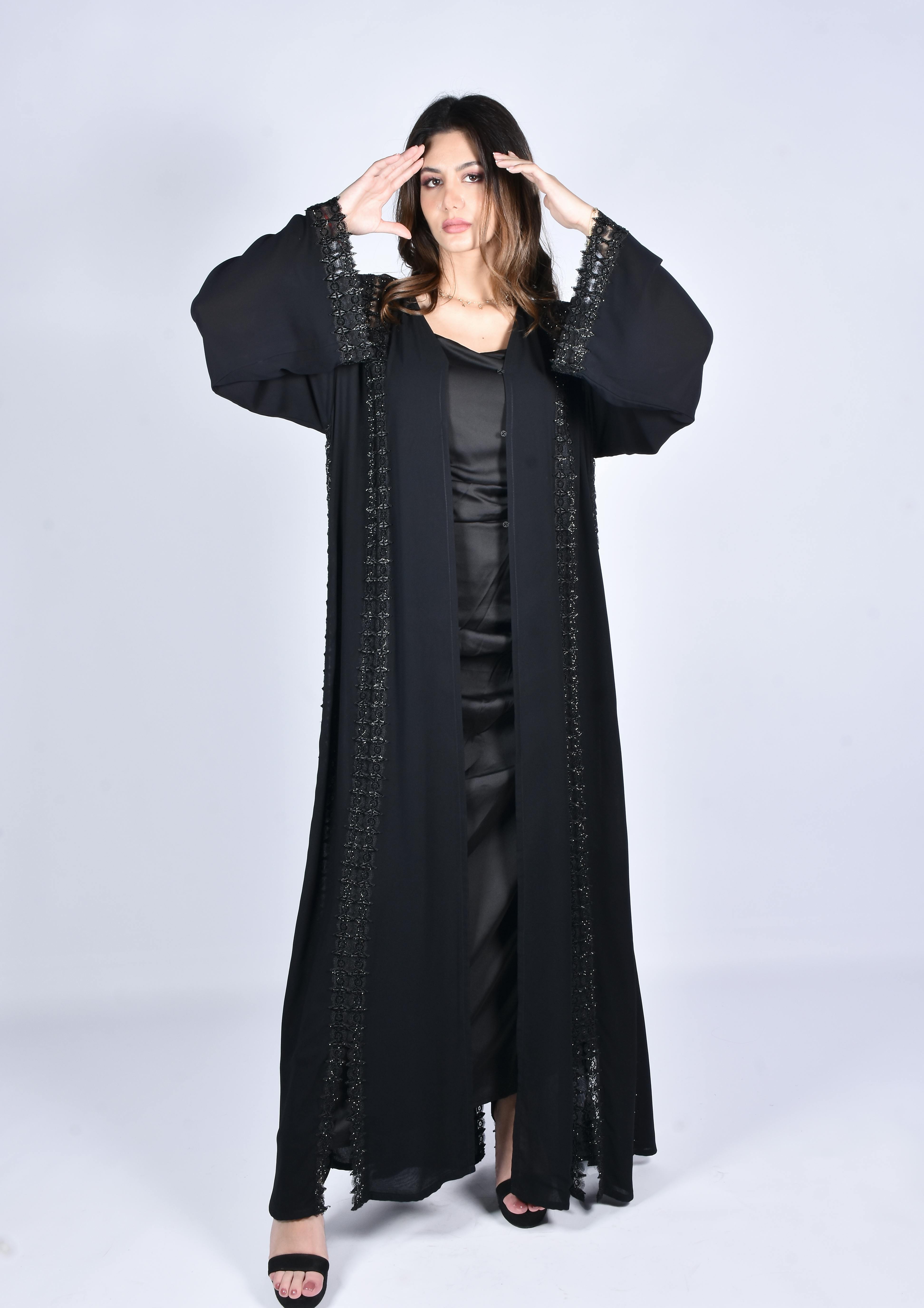 A Woman Wearing Black Dress and Black Abaya · Free Stock Photo