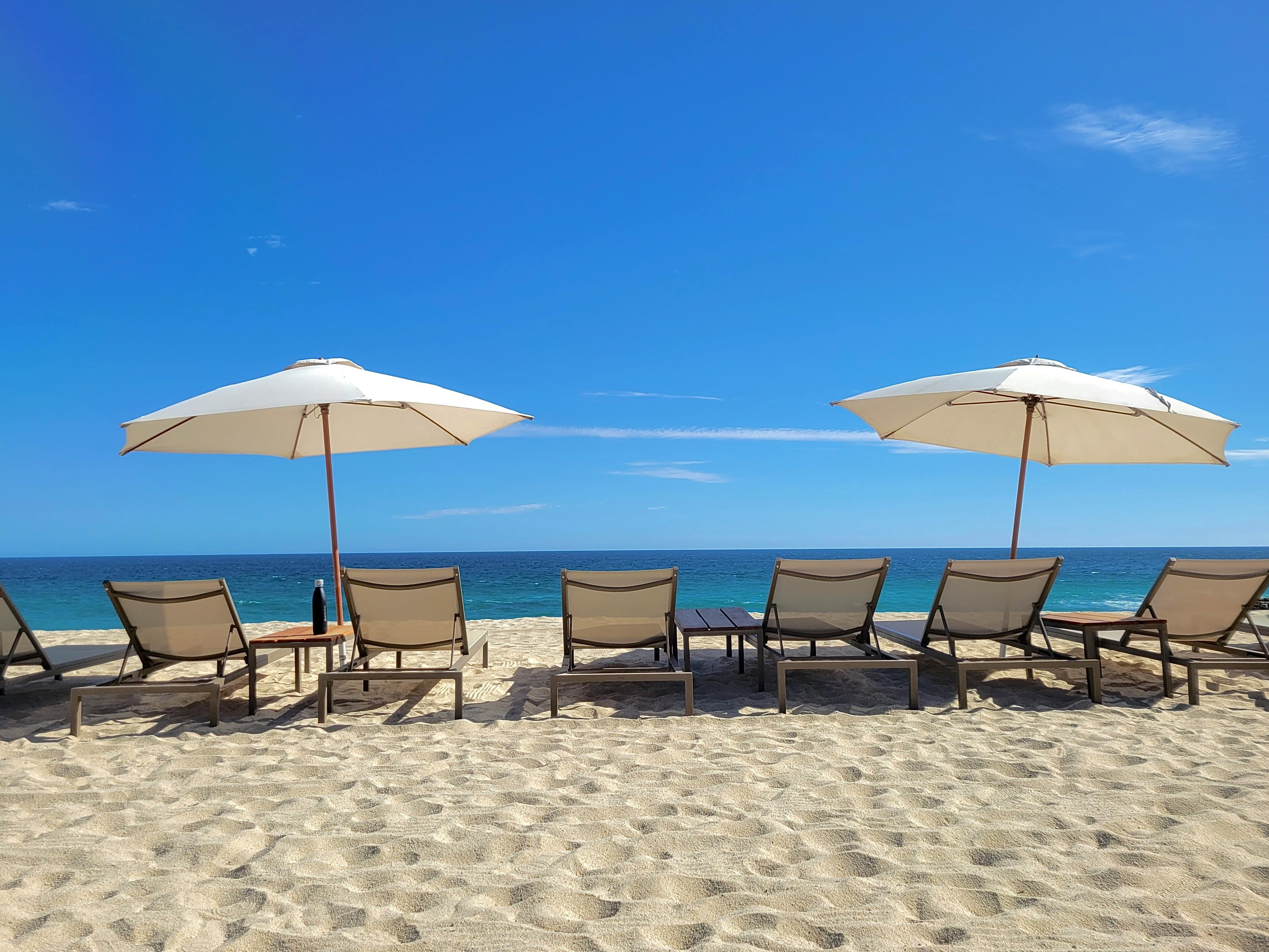 Lifeguard Sitting on the Beach · Free Stock Photo