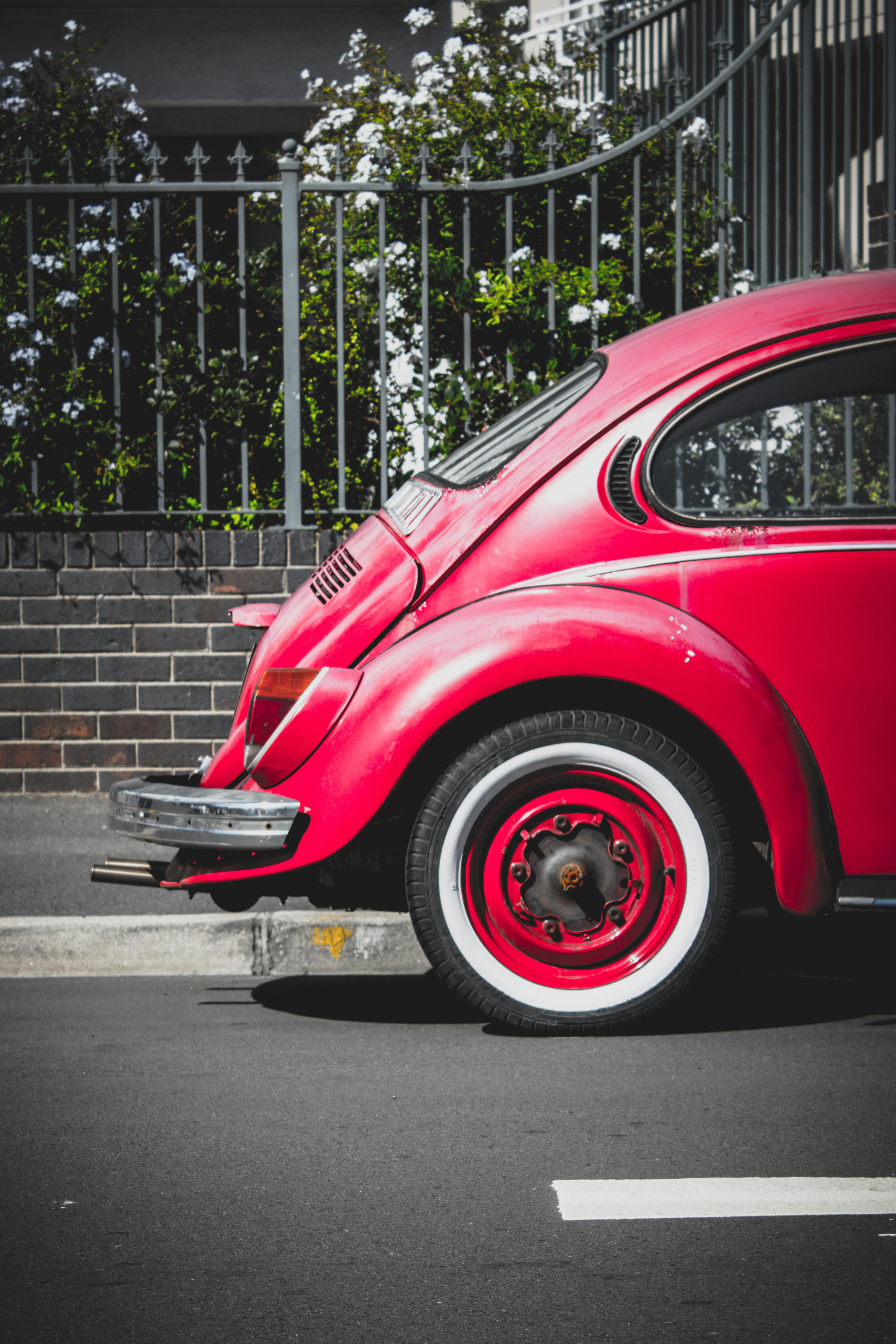Red Car Parked on the Side of the Road · Free Stock Photo