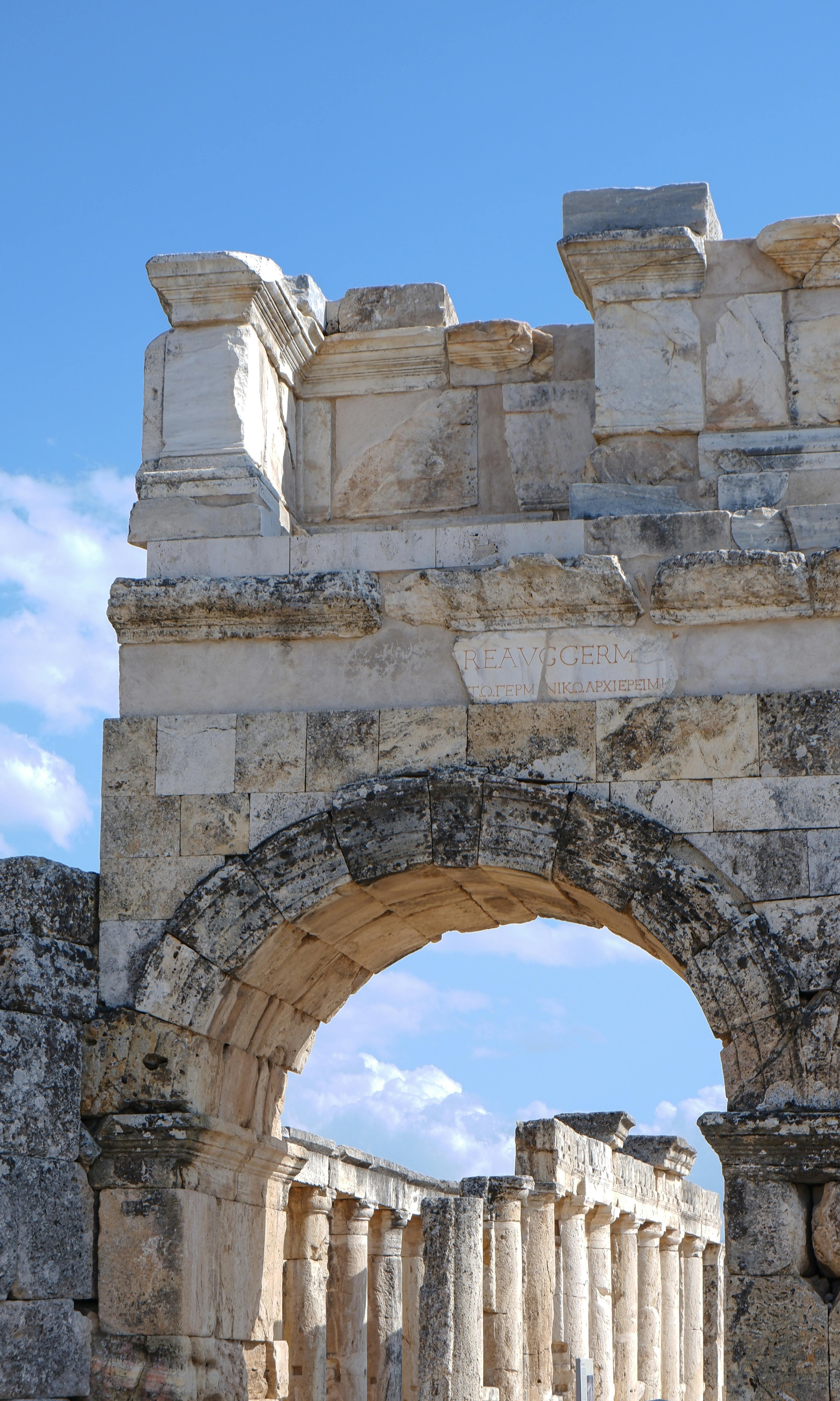Ancient Stone Arch on Blue Sky · Free Stock Photo