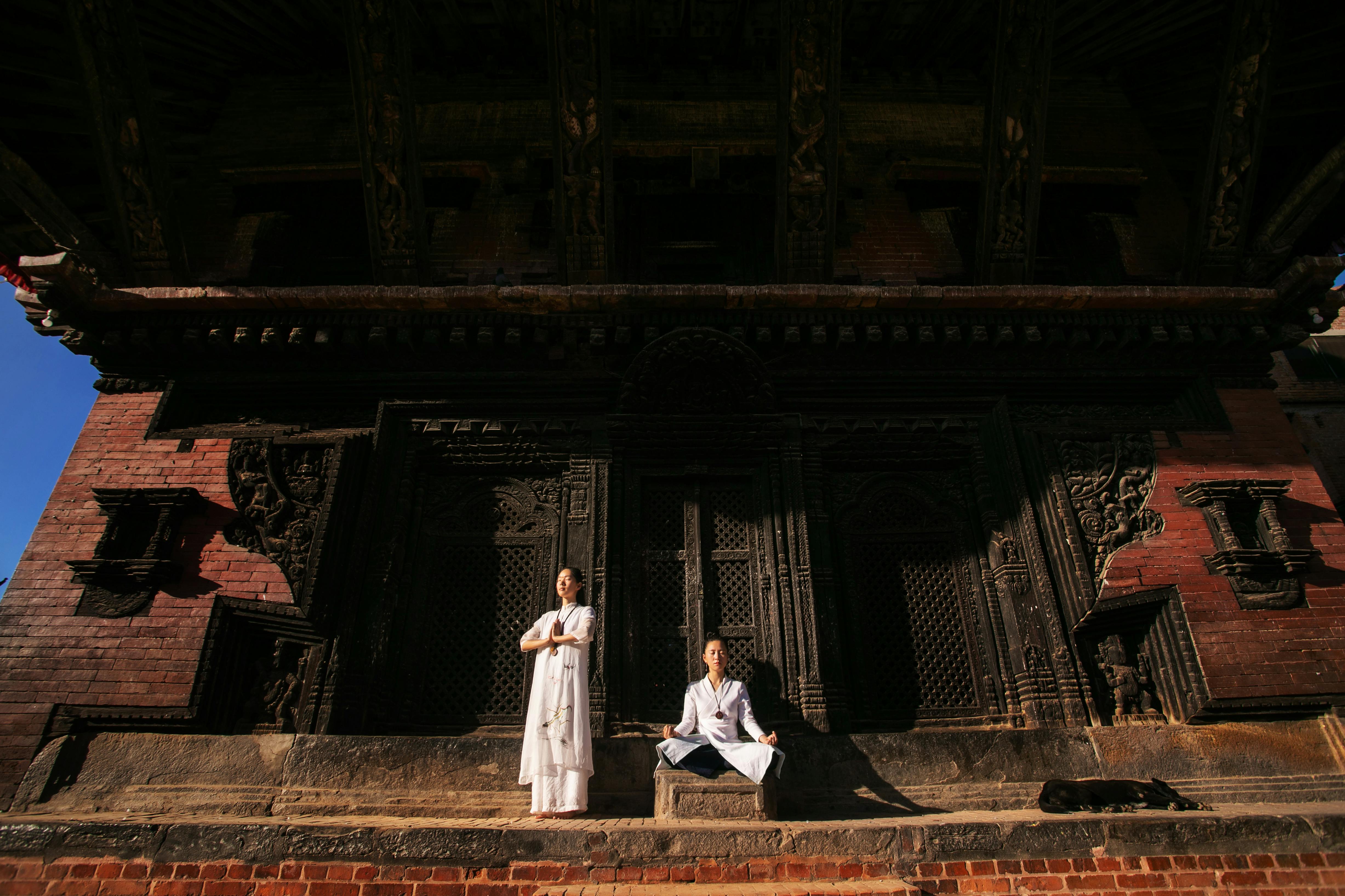 Women Praying in front of a Temple · Free Stock Photo