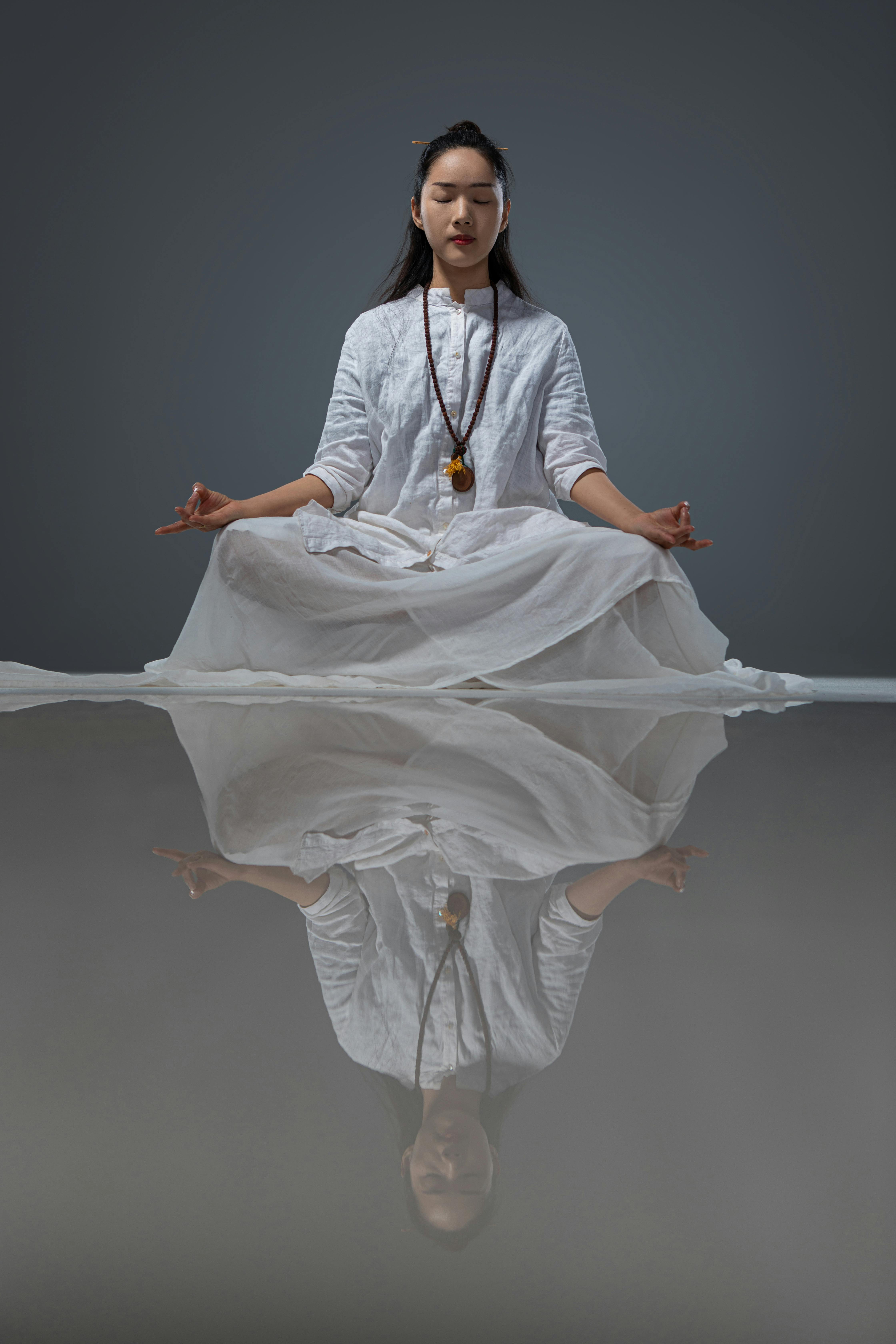 Female Model Crouching in Black Jacket and Black Heels · Free Stock Photo