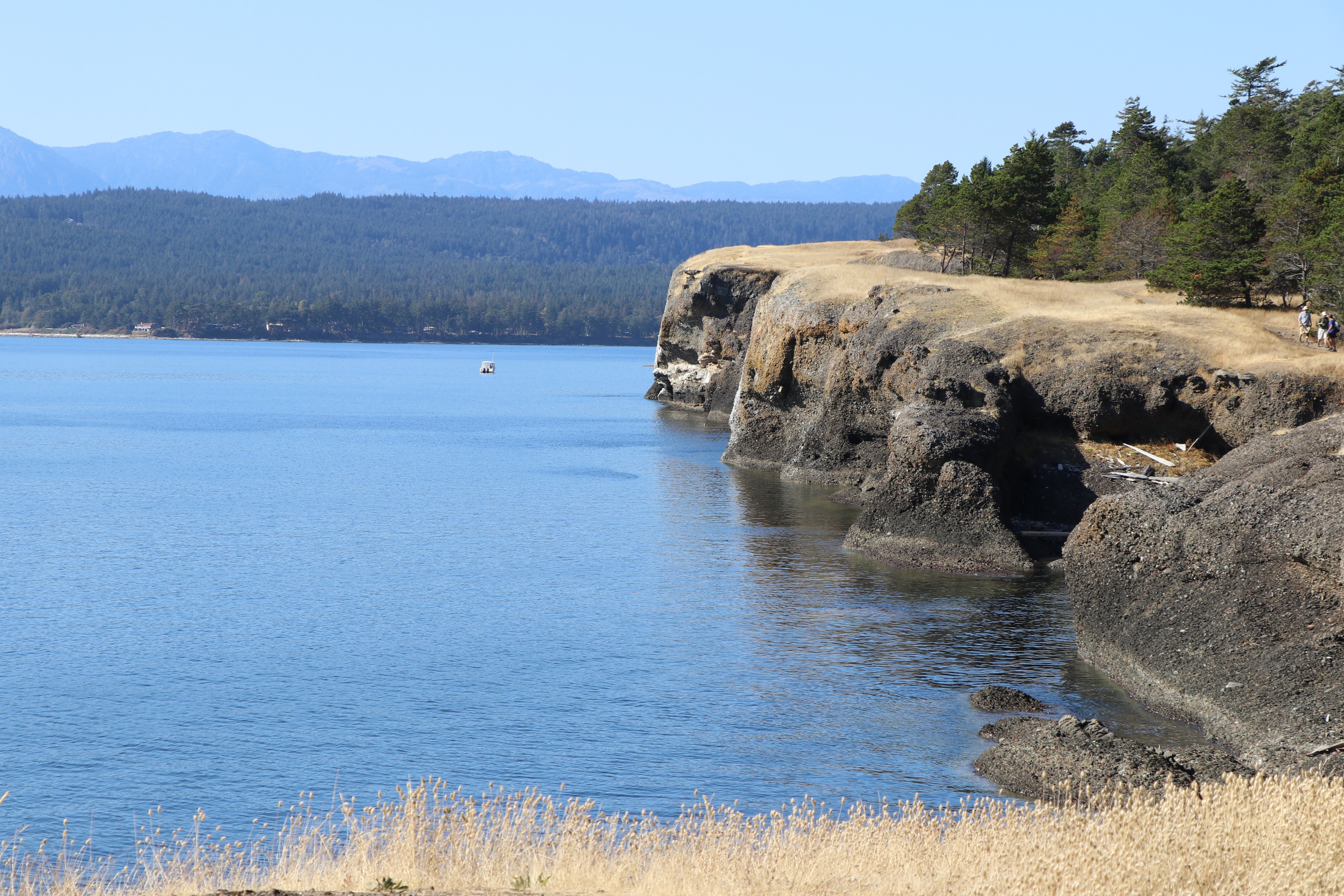 Side View of Cliffs off the Sea · Free Stock Photo