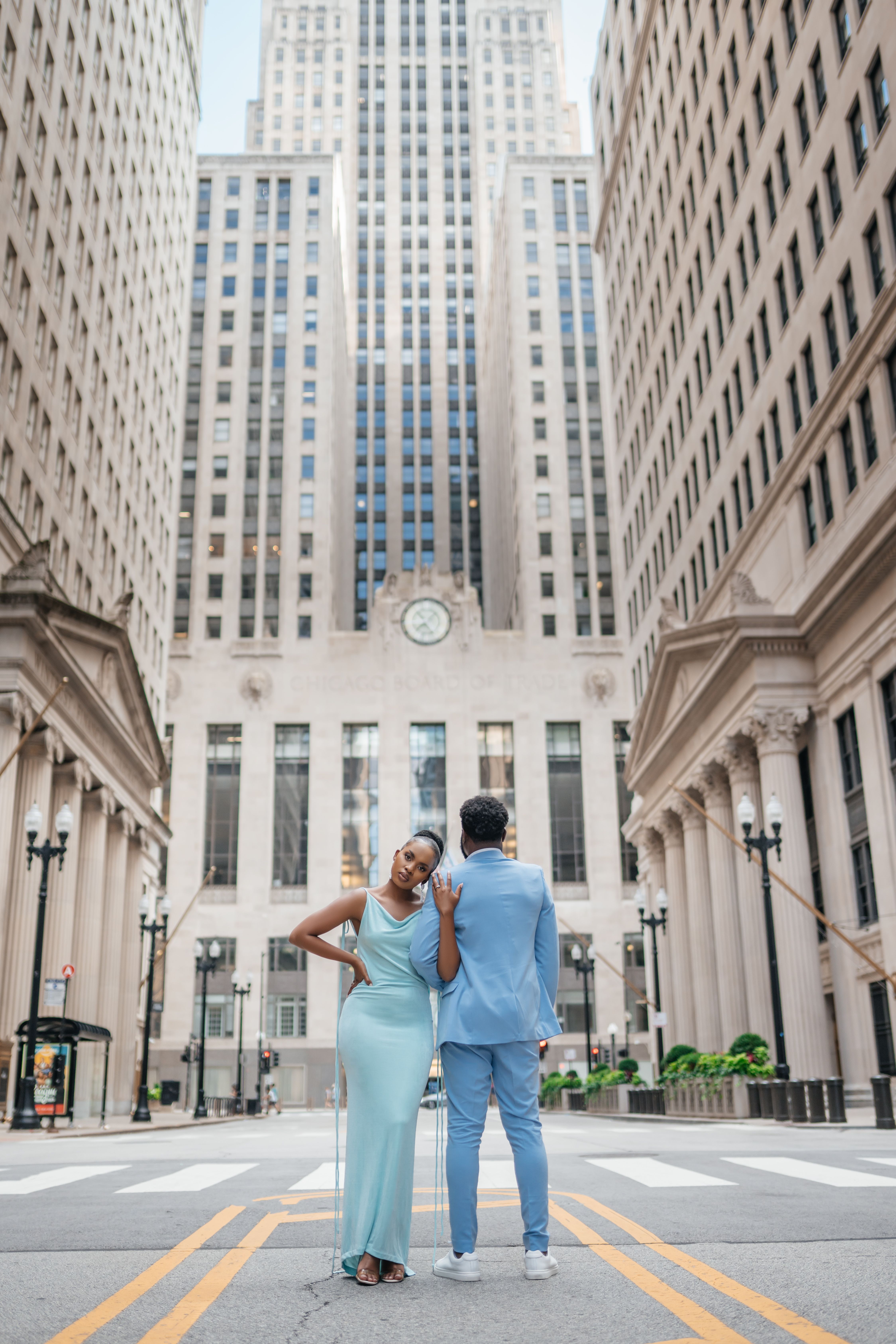 Couple Posing on Street near Old City Buildings · Free Stock Photo