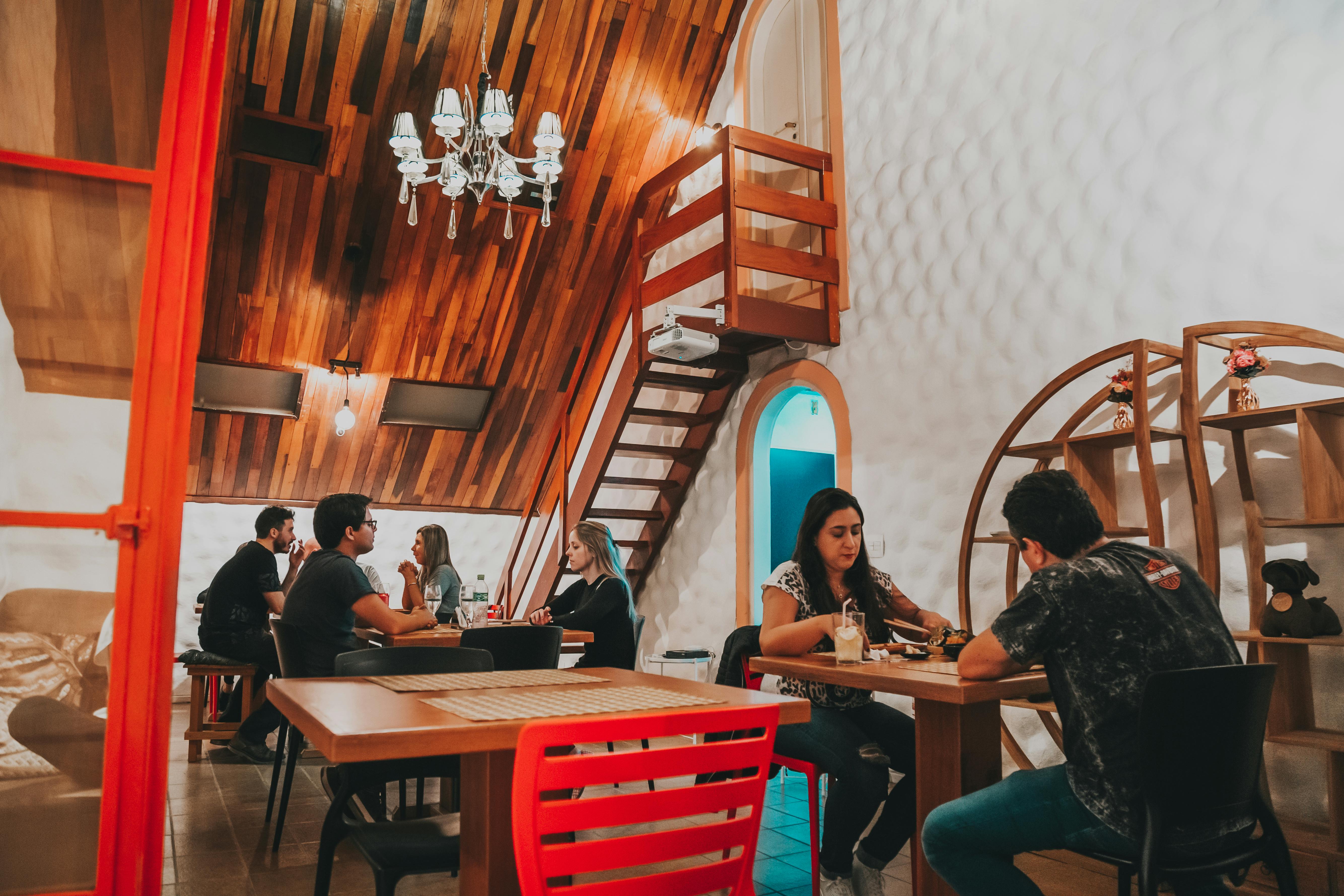 Group of People Sitting on Chair Inside a Restaurant · Free Stock Photo