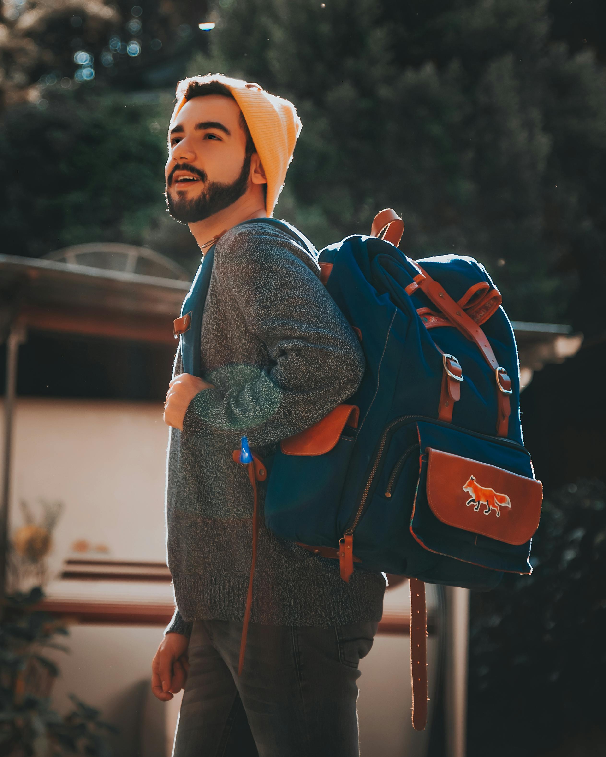 A Bearded Man Carrying a Backpack · Free Stock Photo
