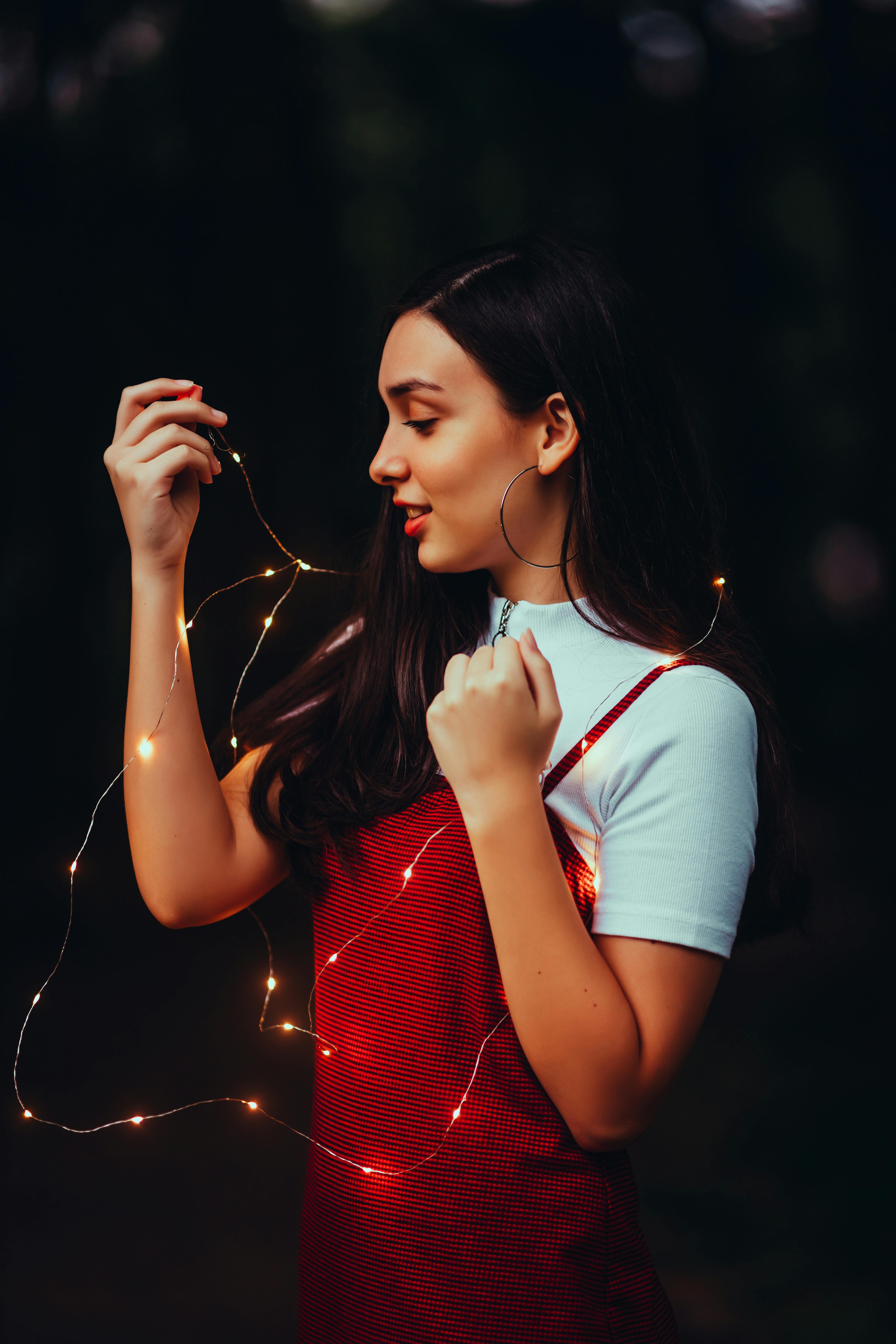 Beautiful Woman Holding String Lights · Free Stock Photo