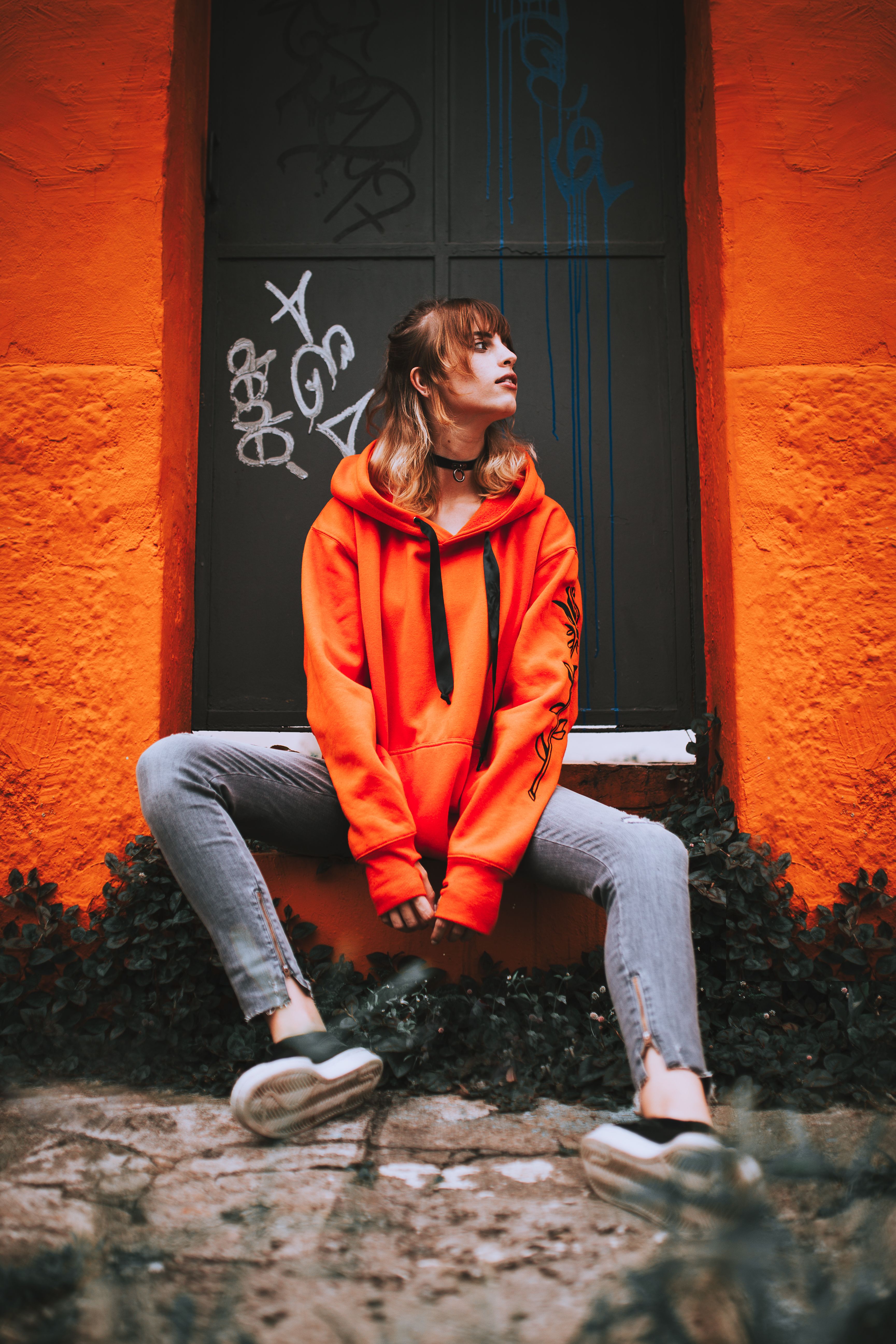 Teen Girl Standing near Building Wall Outside · Free Stock Photo