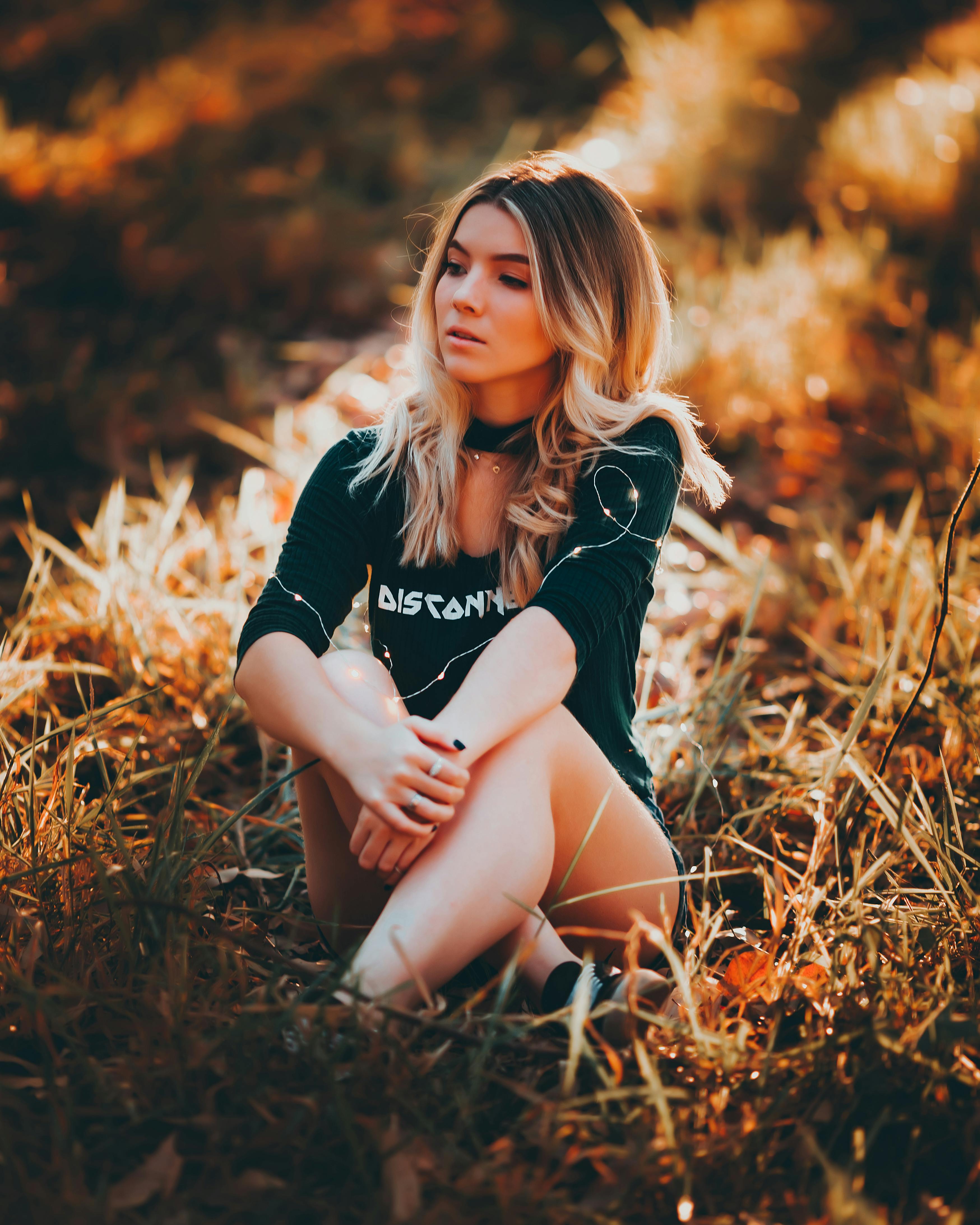 A Woman Sitting on the Grass · Free Stock Photo