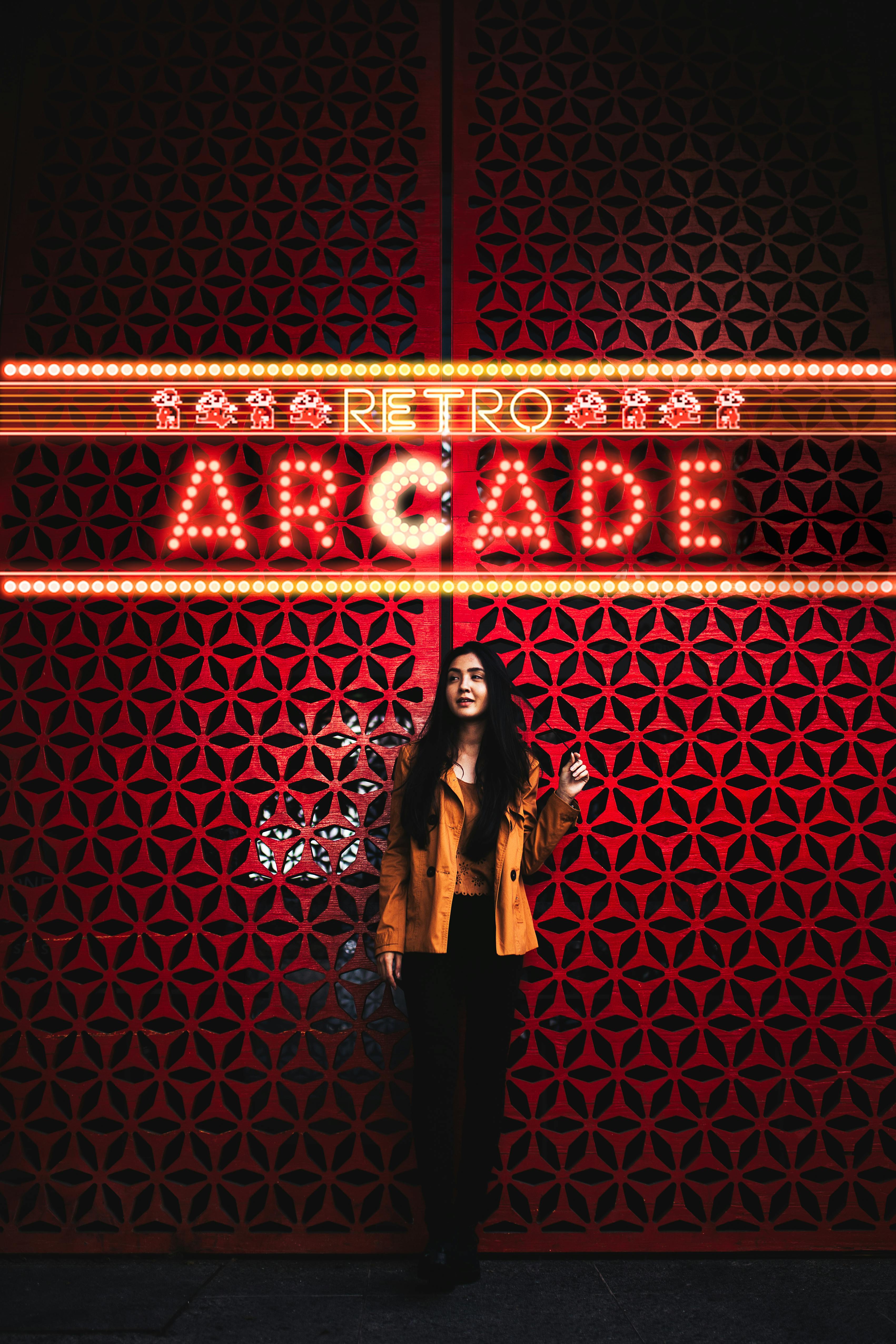 Neon Sign on a Green Wall · Free Stock Photo