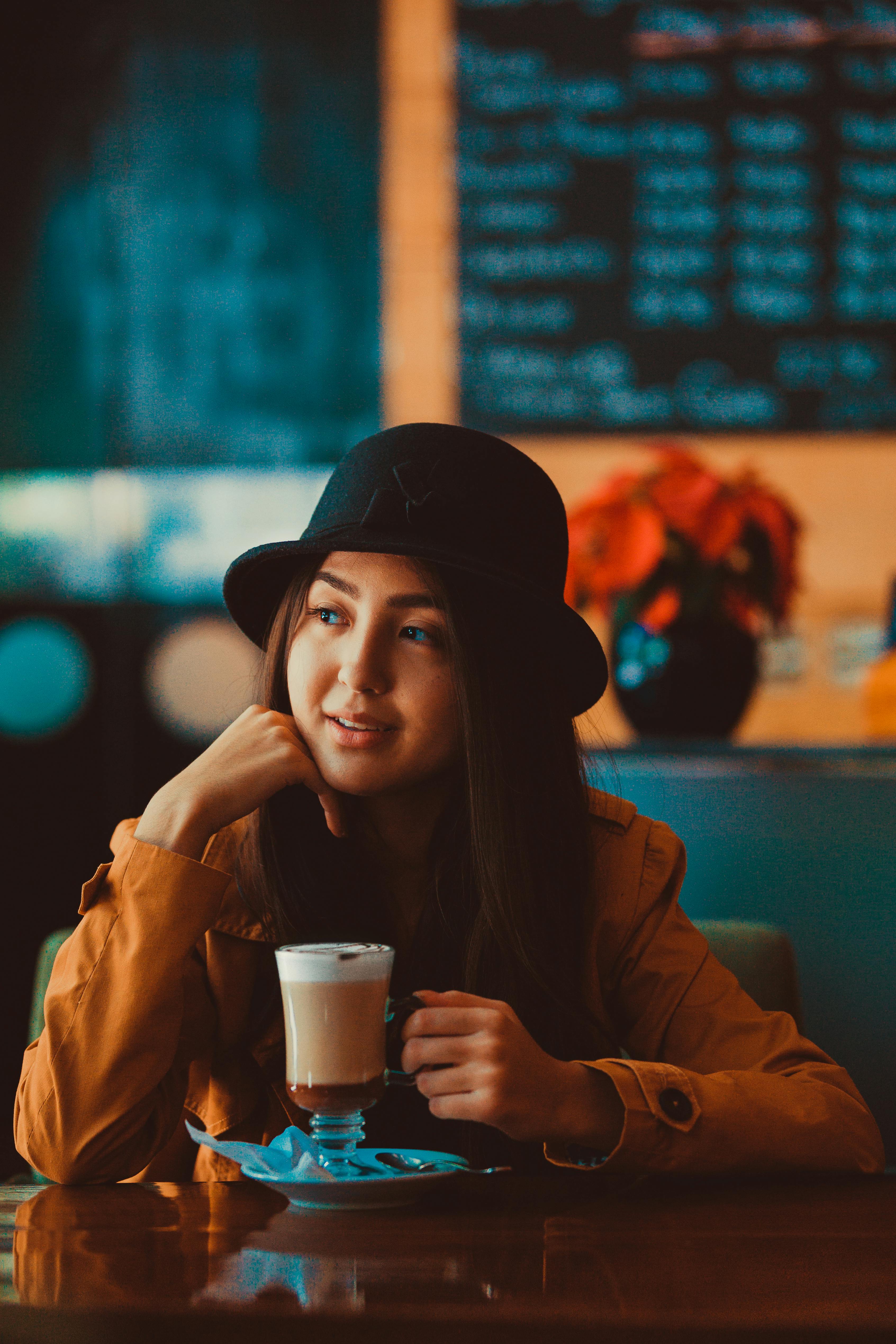 A Woman in a Coat Praying · Free Stock Photo