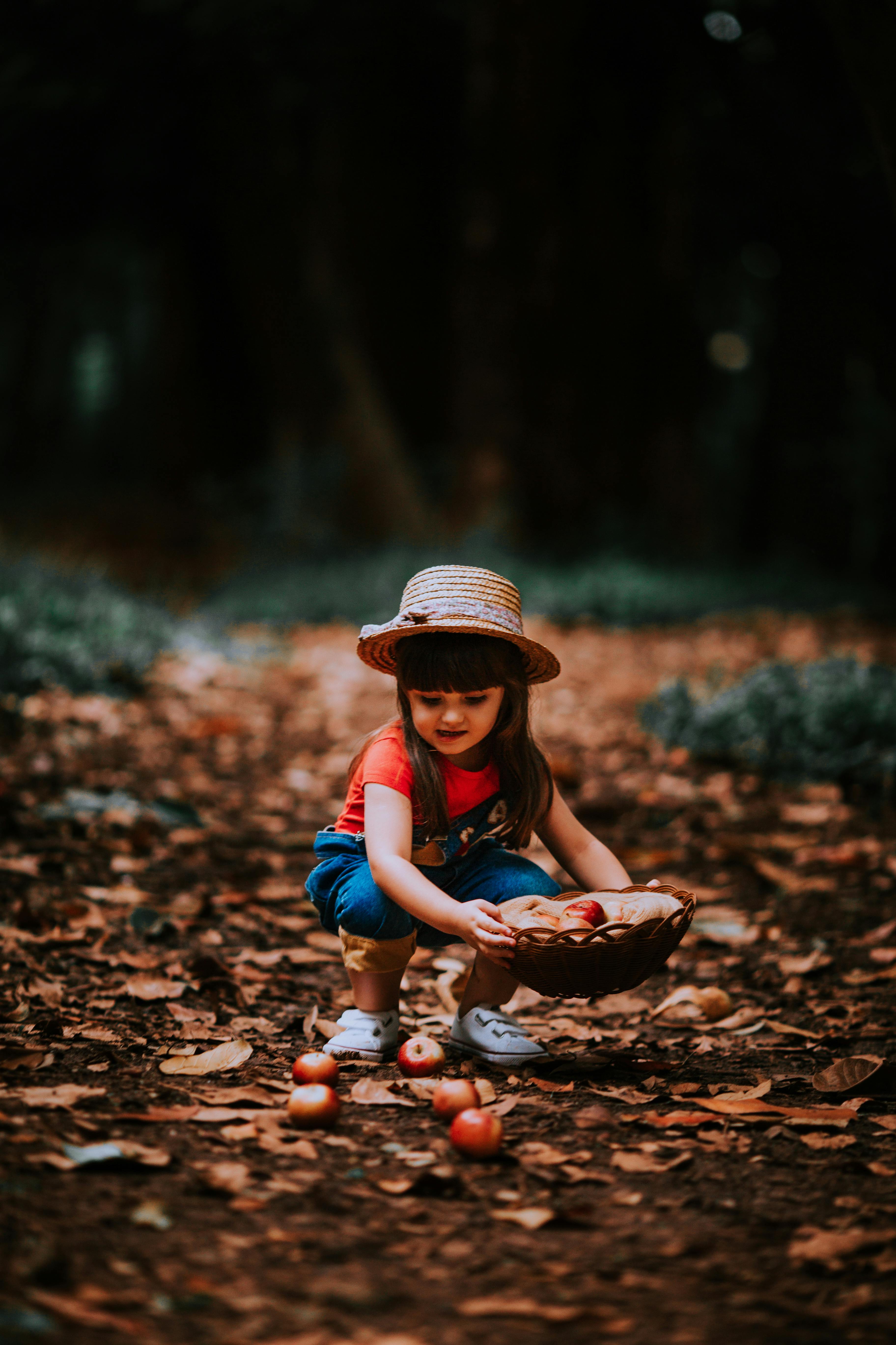 Photo of an Upset Kid Crouching · Free Stock Photo