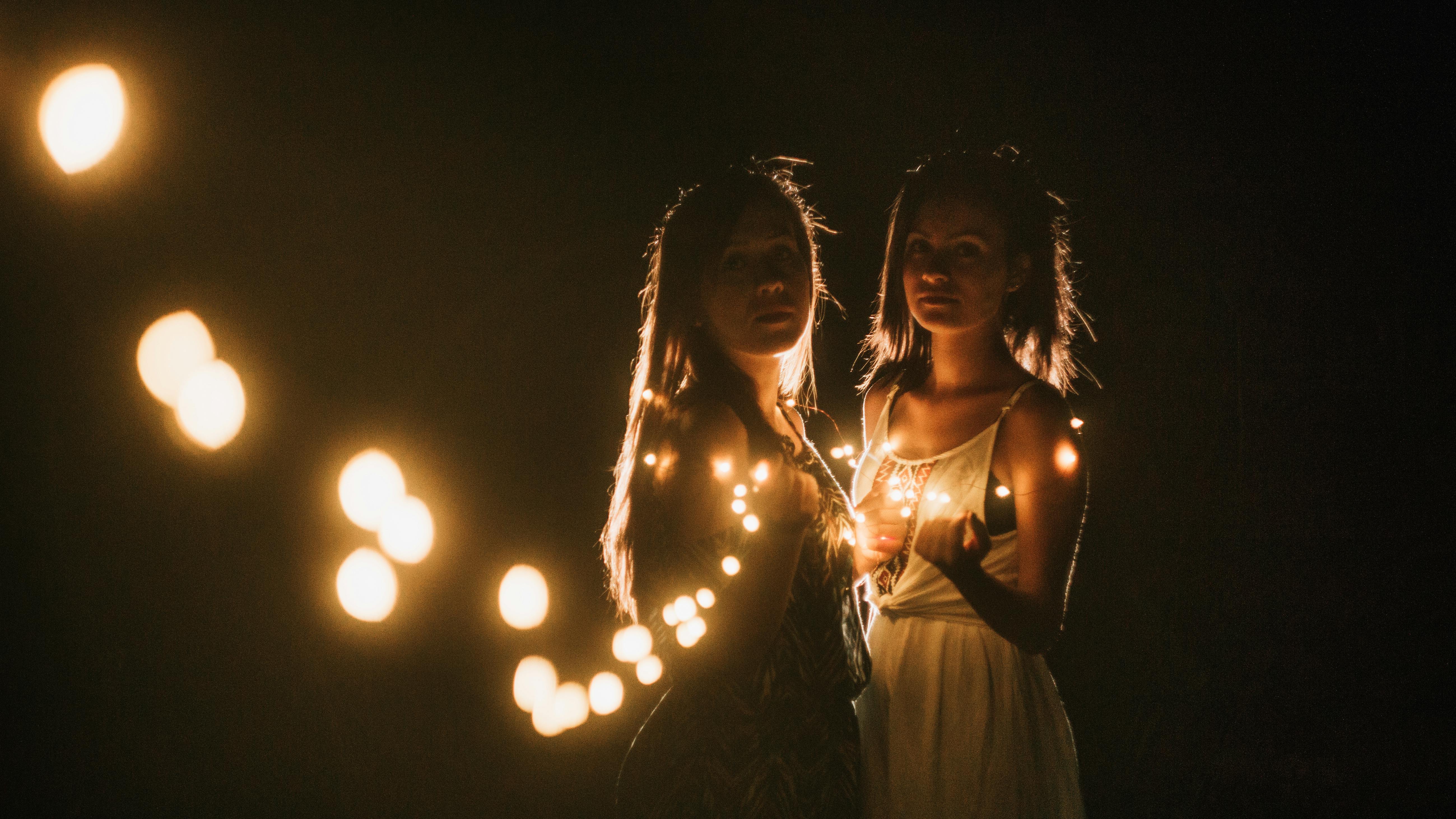 Girls Posing with Lights in Dark · Free Stock Photo
