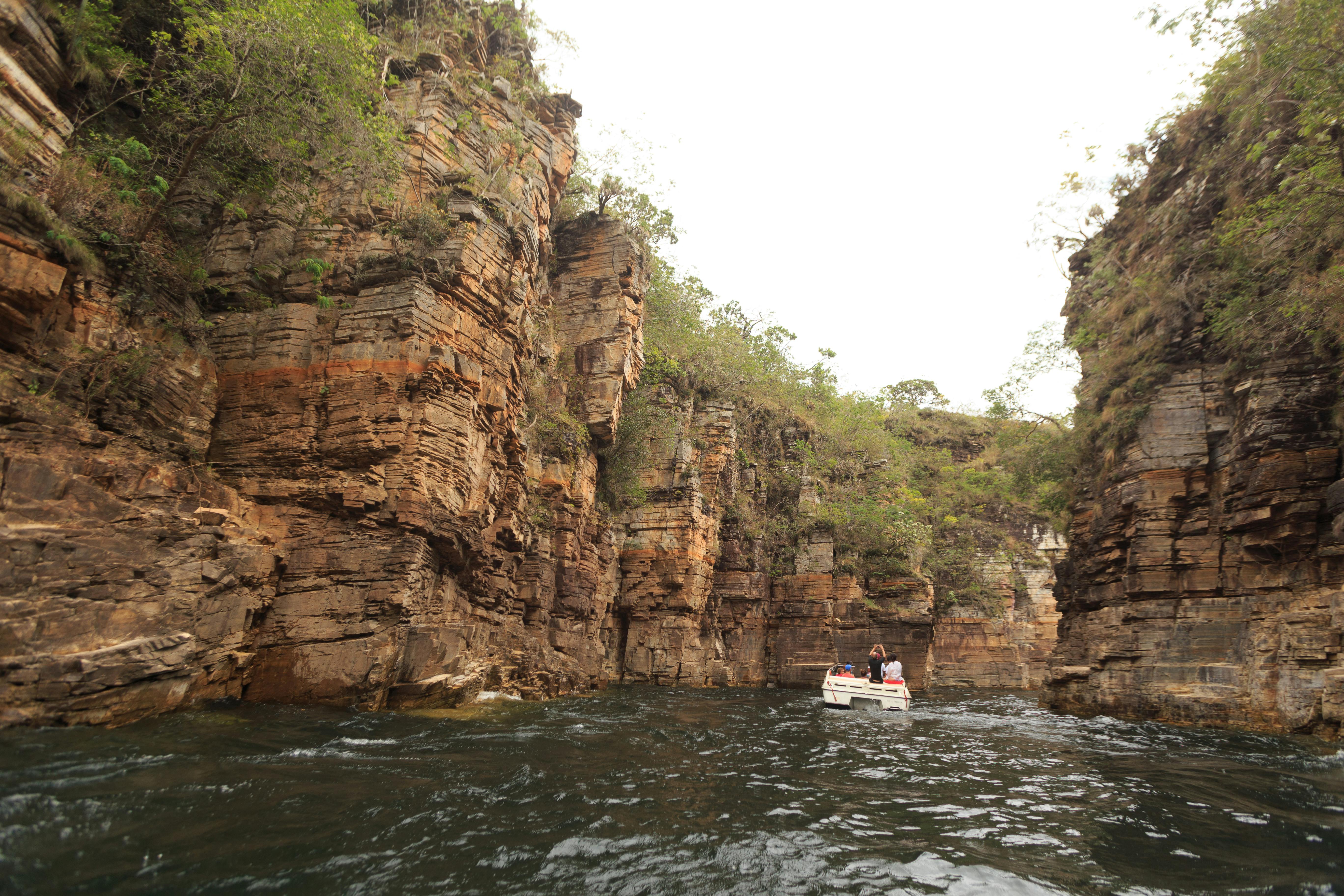 People Riding a Boat Traversing a River · Free Stock Photo