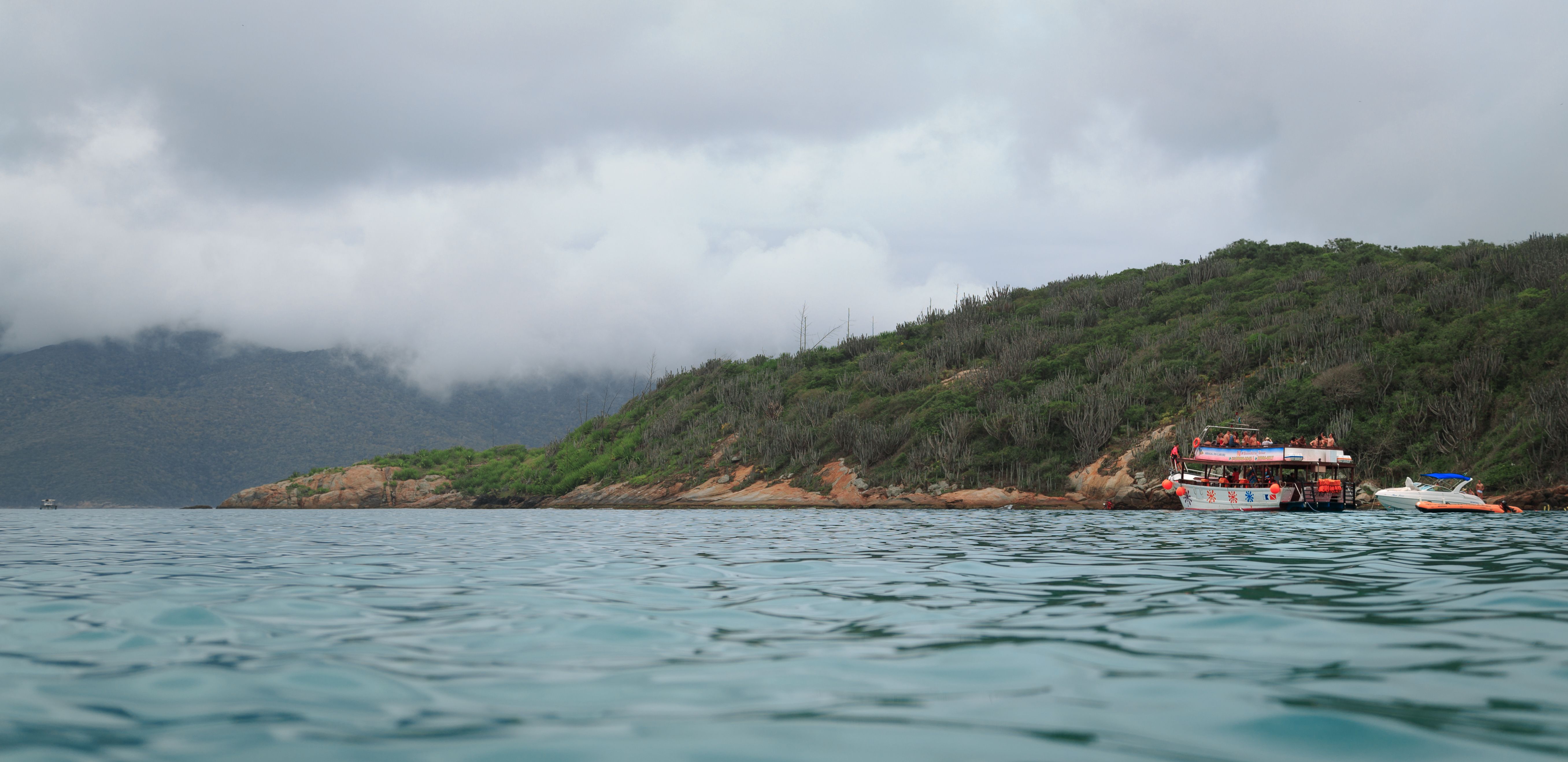 A Boat Sailing on the Sea Near an Island · Free Stock Photo