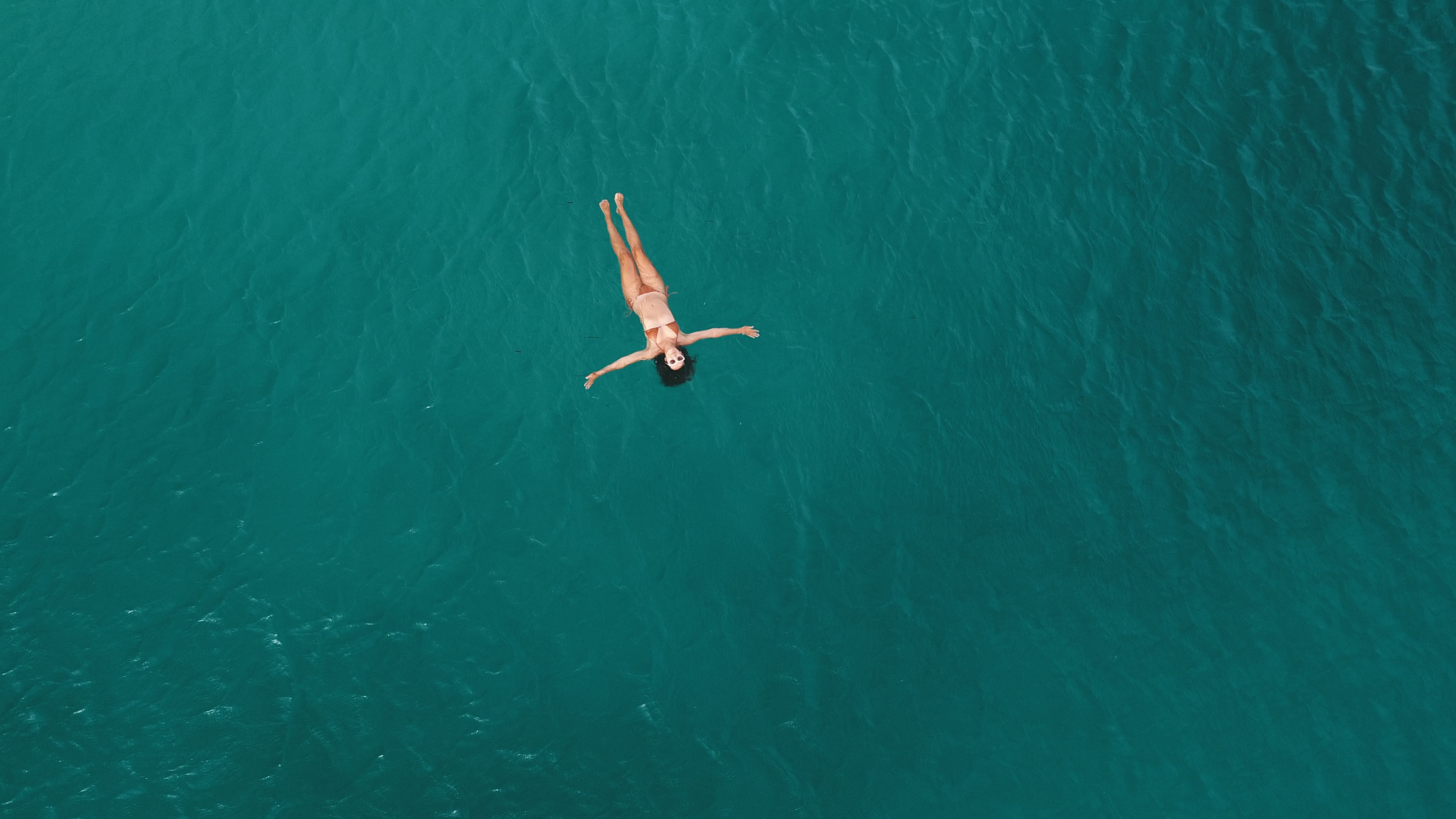 A Woman Floating on the Water · Free Stock Photo