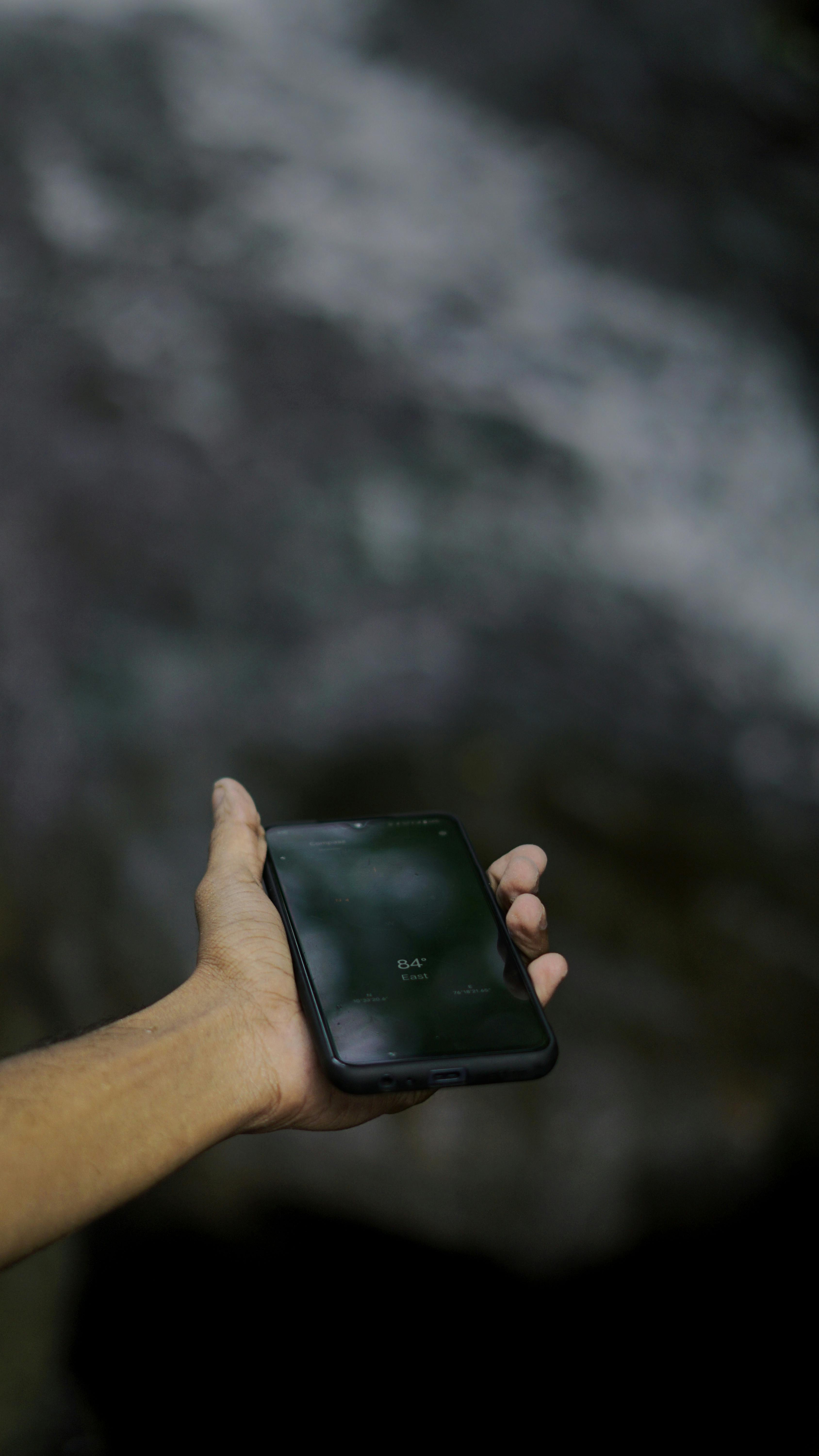 Person Holding a Smartphone · Free Stock Photo