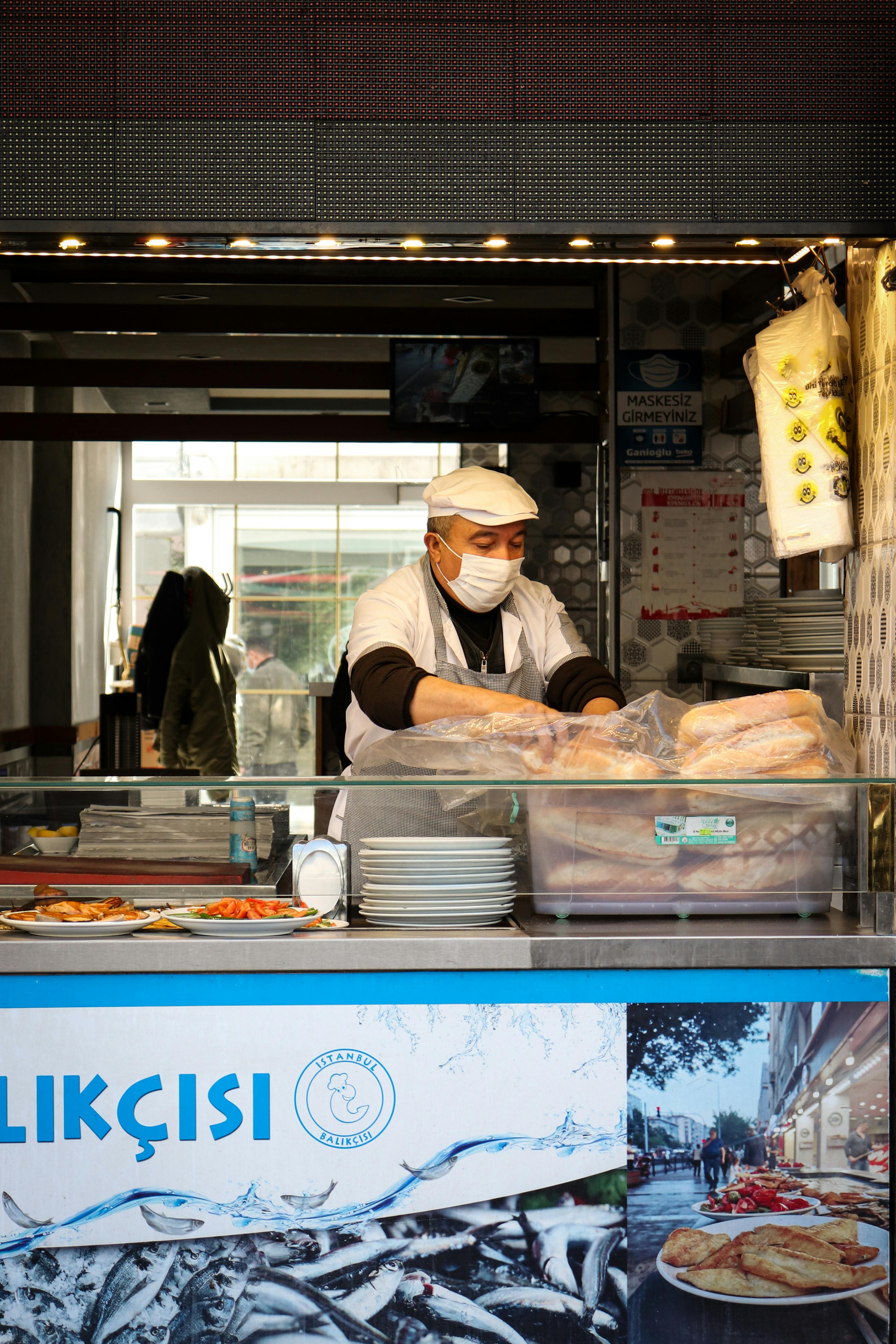 A Man Inside a Food Stall · Free Stock Photo