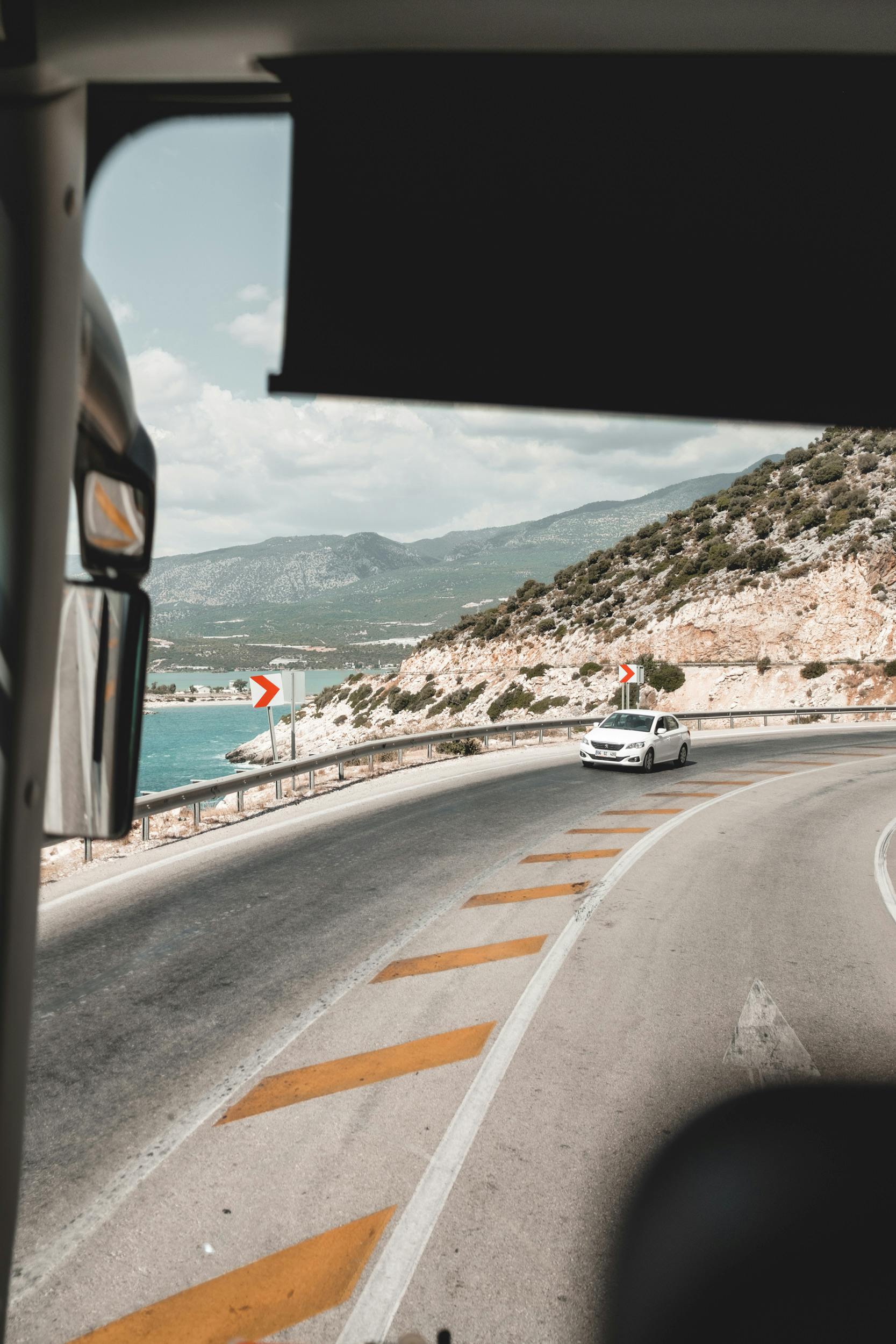 View of White Car Moving on the Road from the Windshield of a Vehicle ...