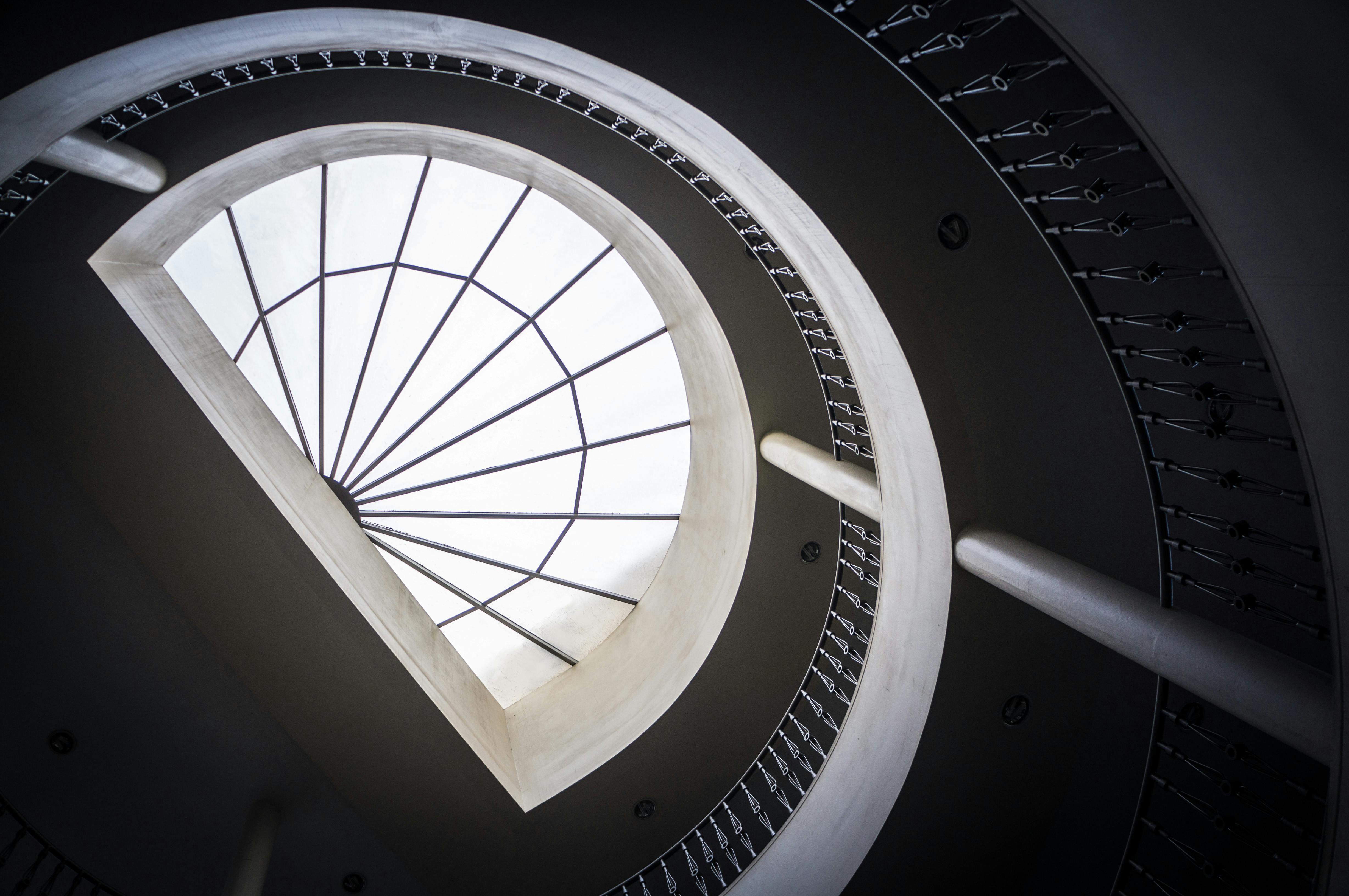 Low Angle Photo of Brown and White Spiral Stairs Building · Free Stock ...