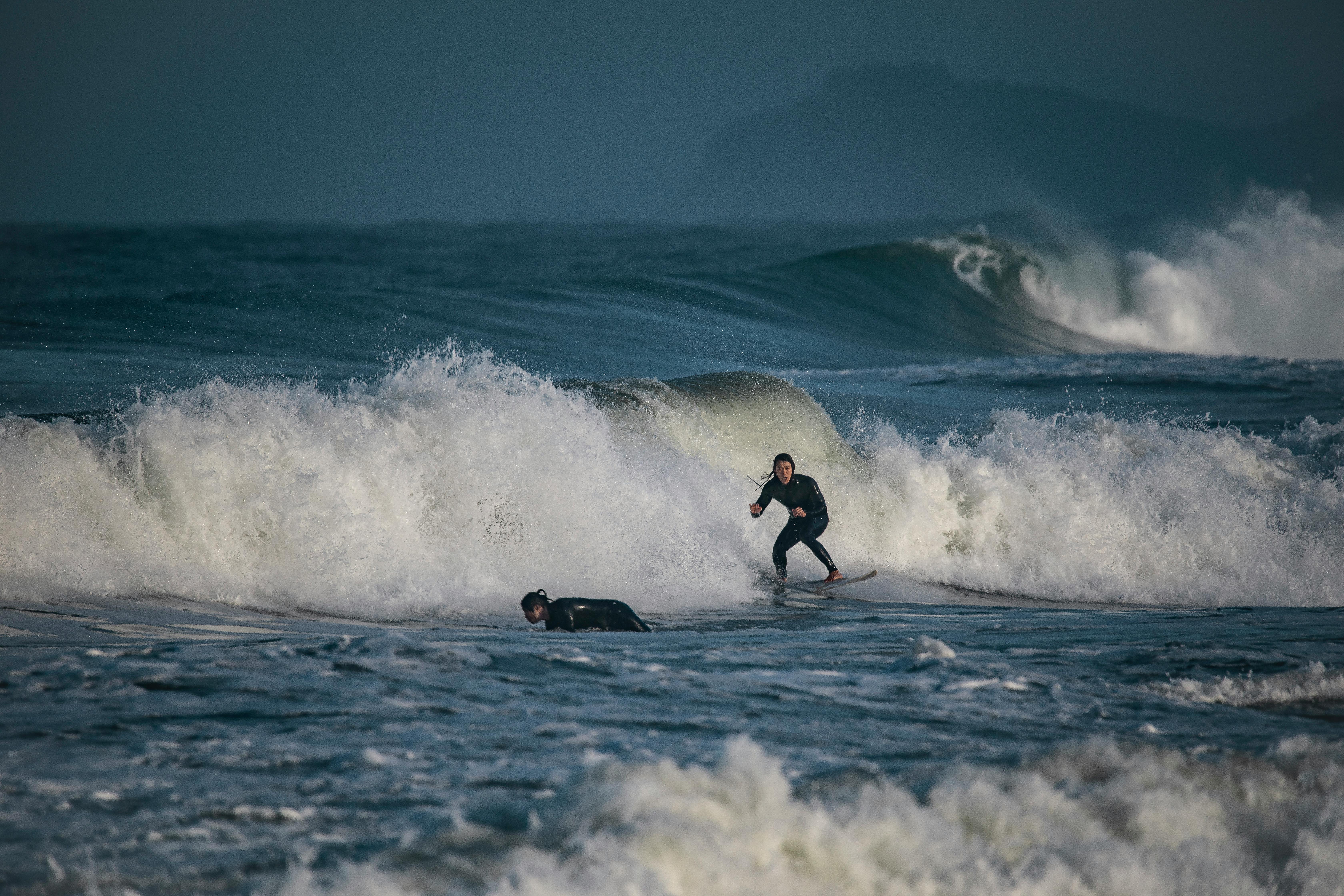 People Surfing on Waves in Ocean · Free Stock Photo