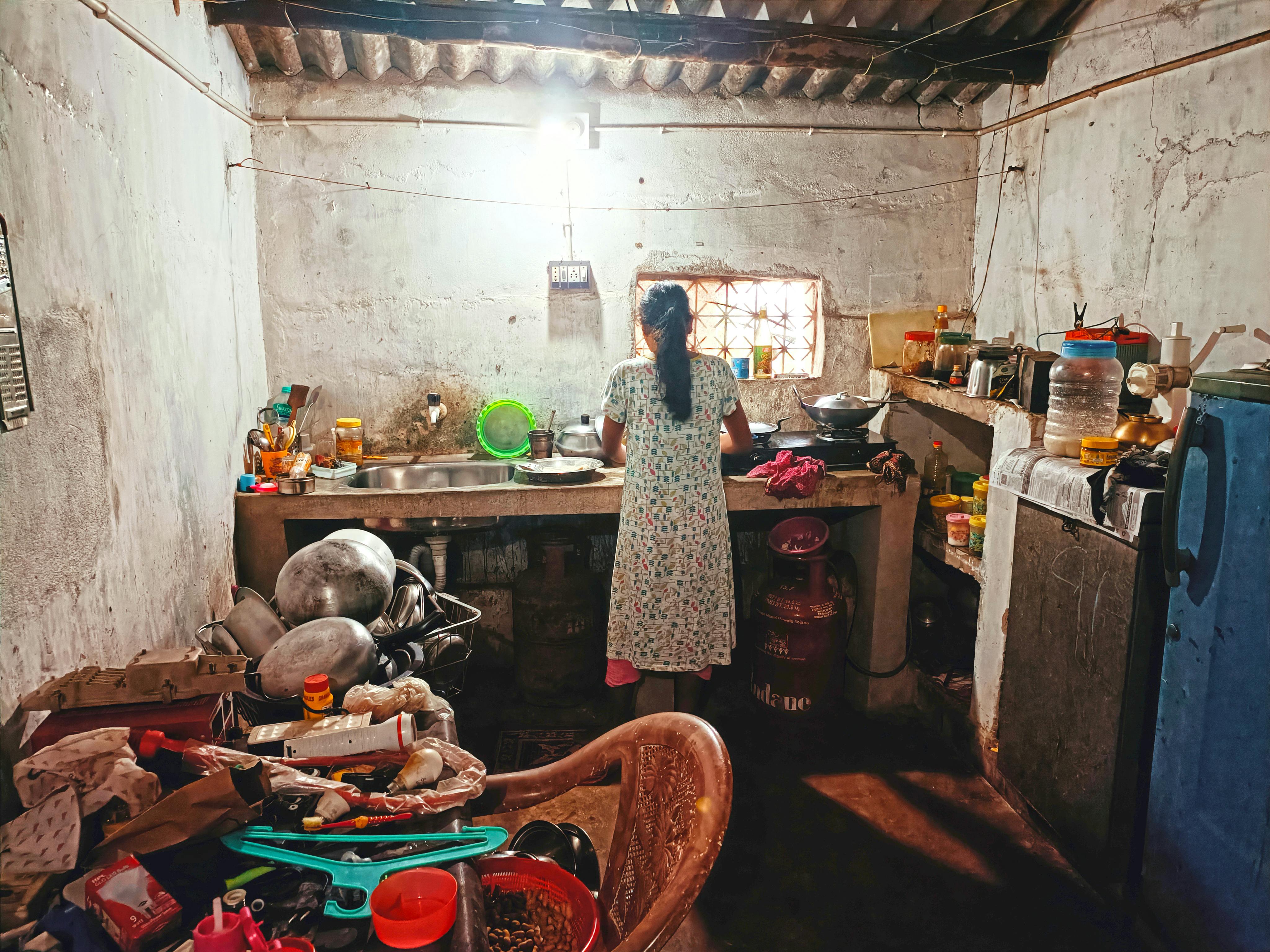 Woman in Floral Dress Inside a House · Free Stock Photo