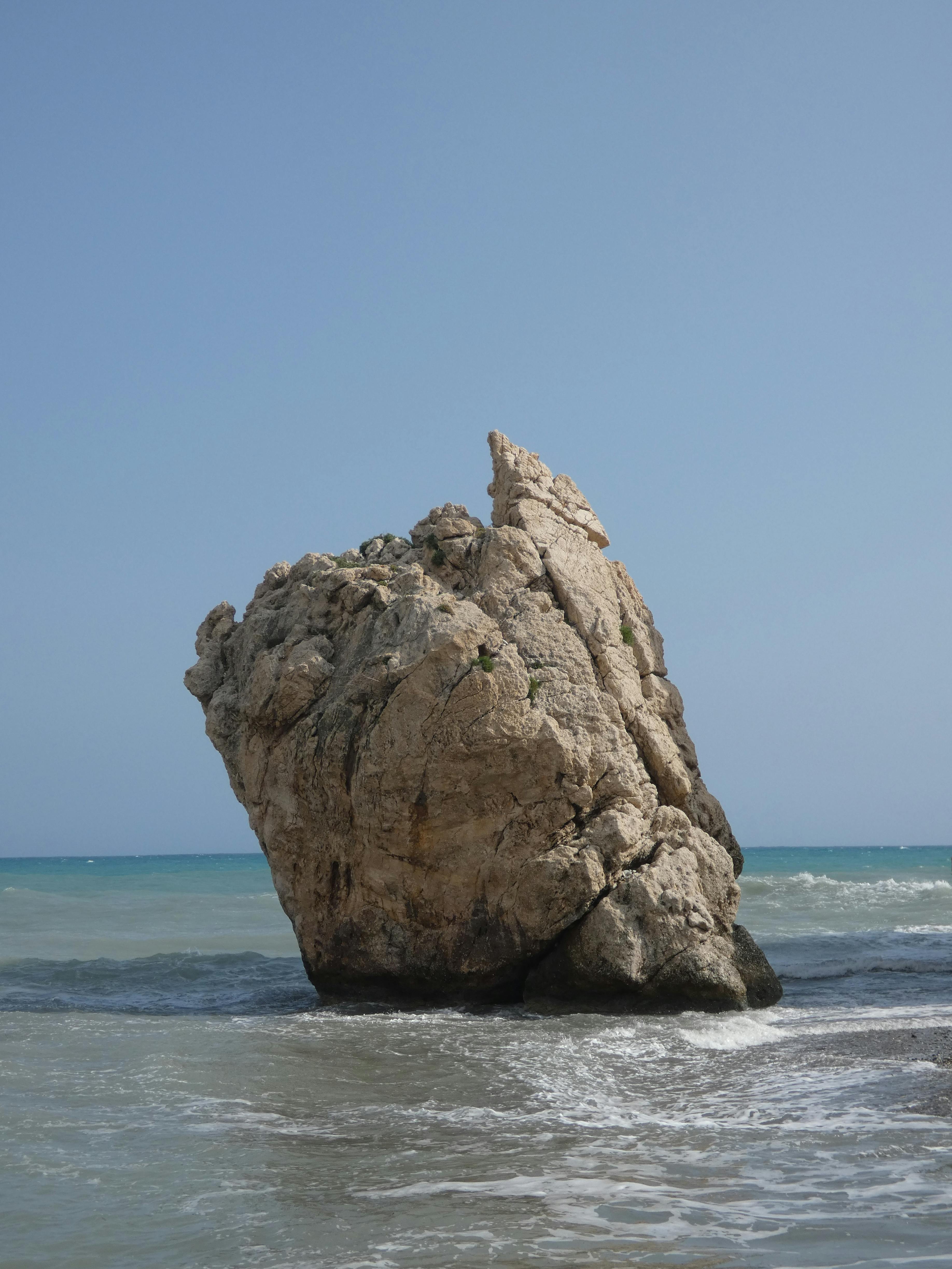 A Big Rock Formation in the Sea · Free Stock Photo