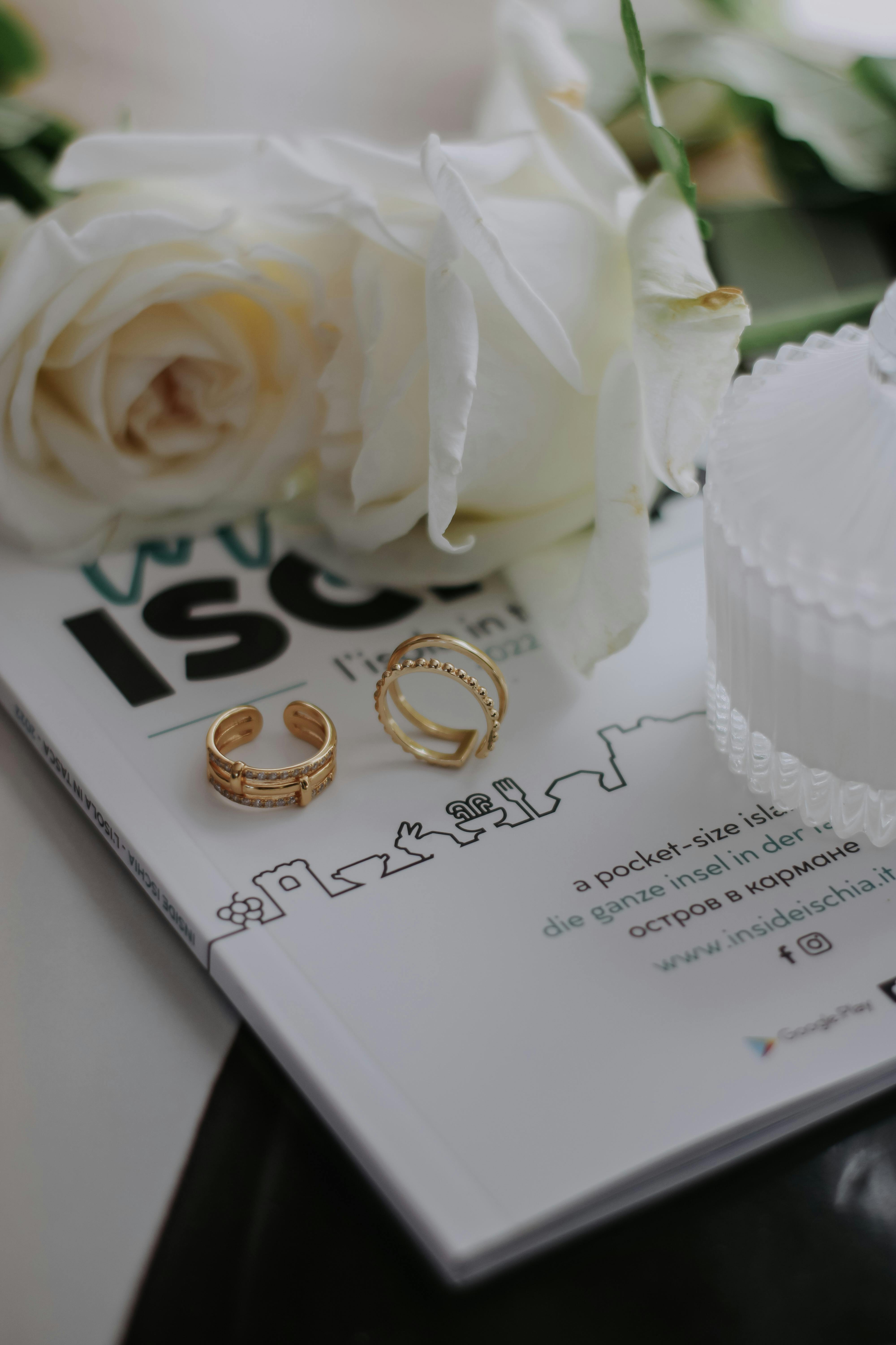 Gold Rings on a Book · Free Stock Photo