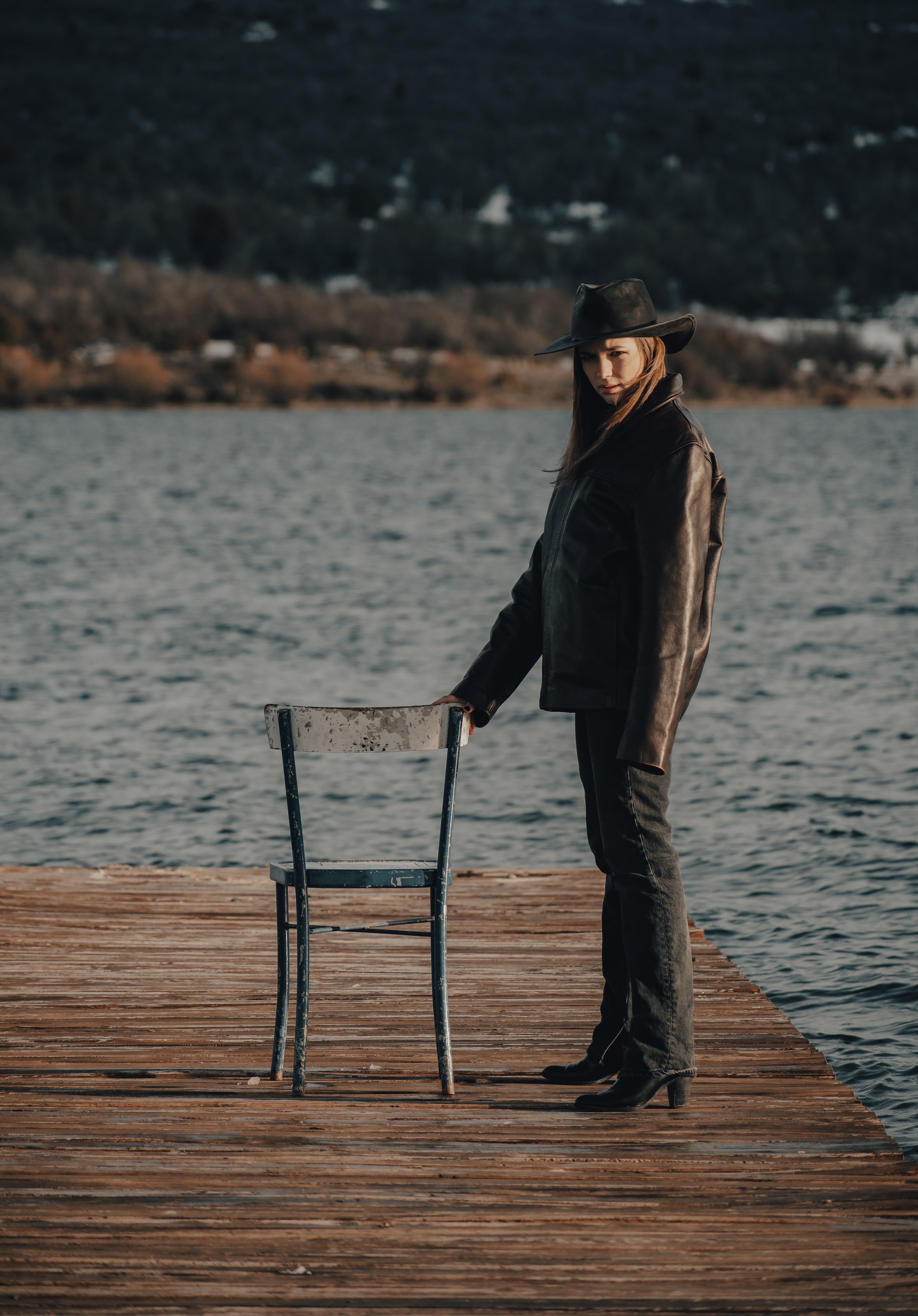 Woman Holding on a Chair · Free Stock Photo