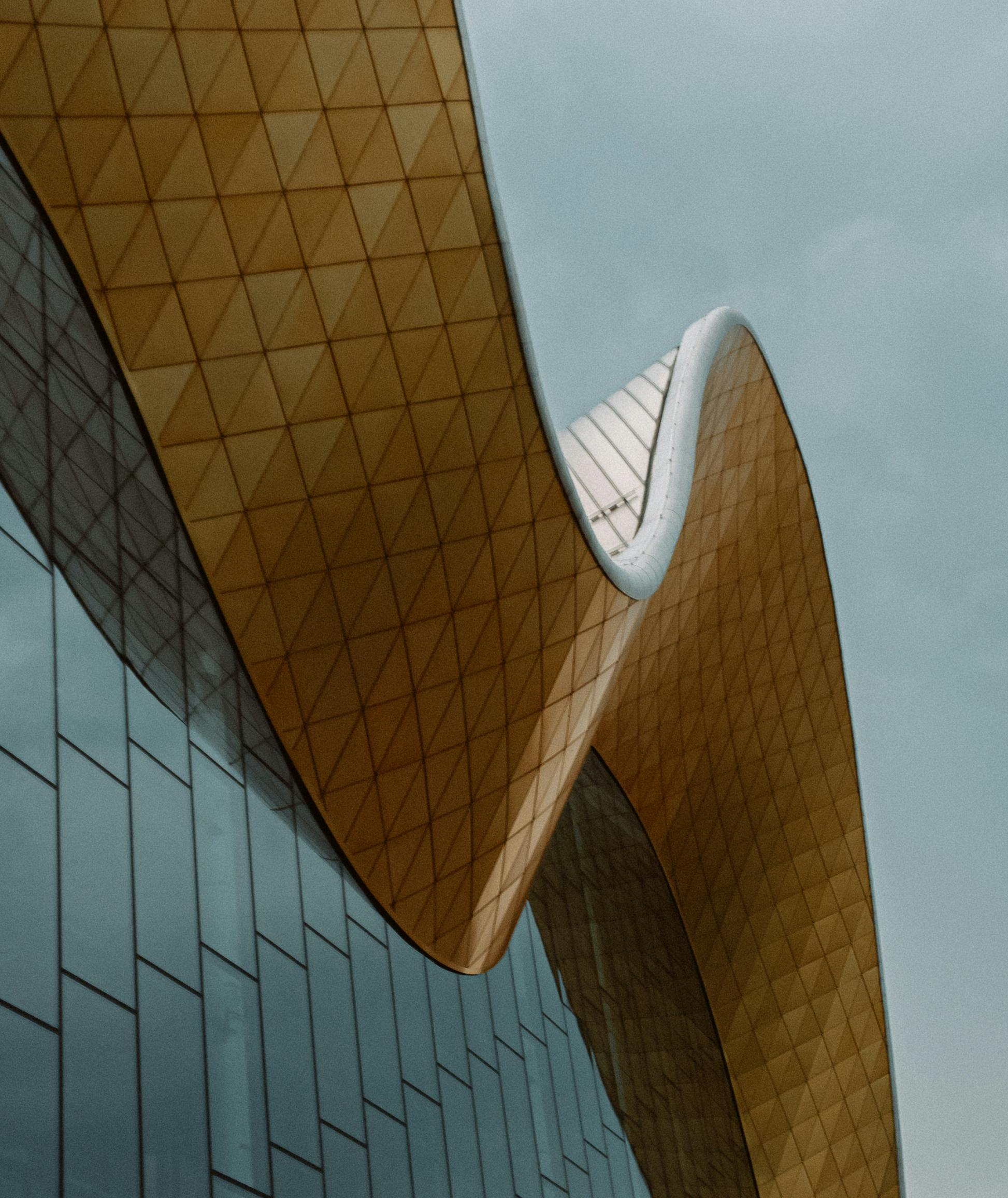 Modern Building with an Undulating Roof · Free Stock Photo