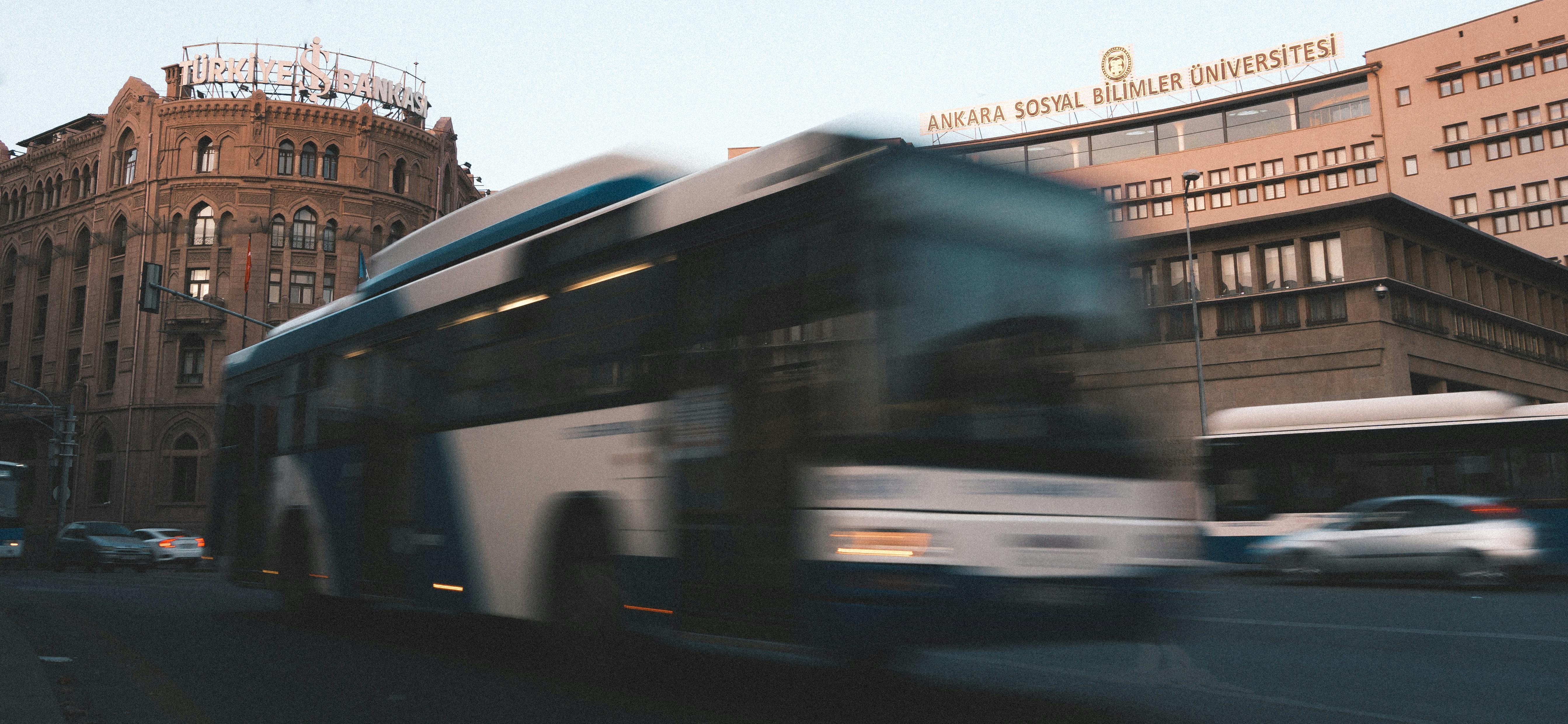 White Bus on Road Near in High Rise Building during Daytime · Free ...